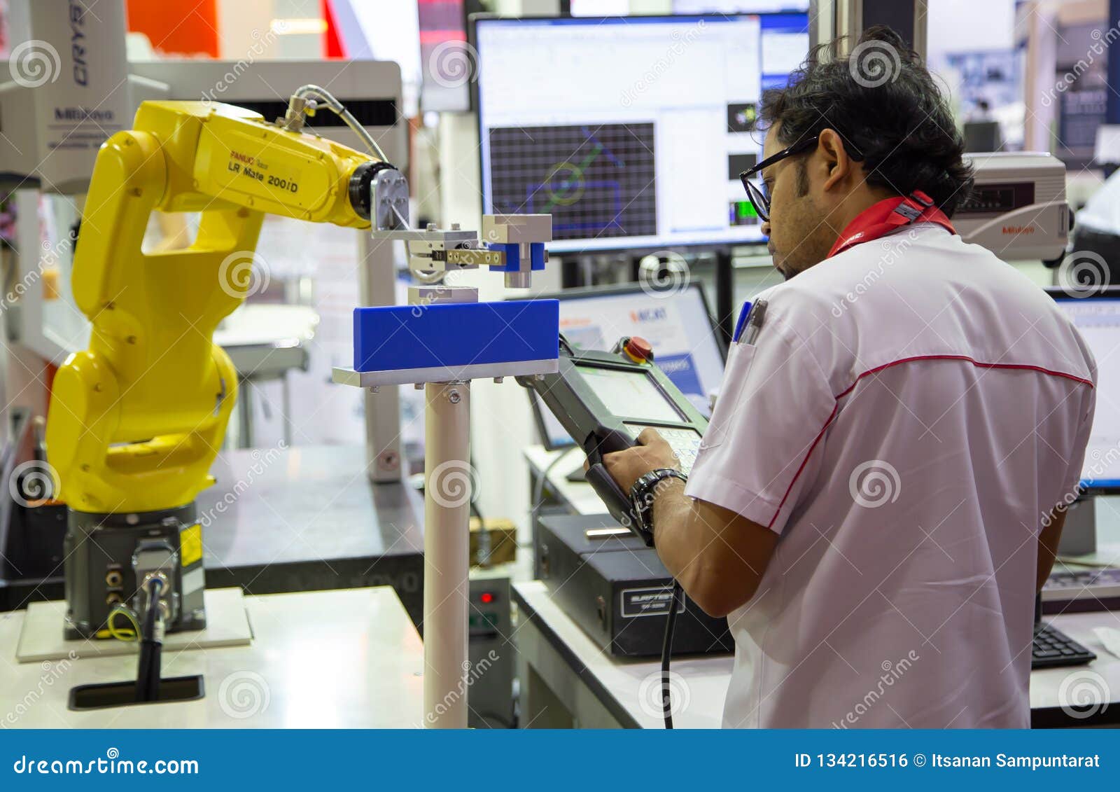 Worker Control Robot Arm To Loading And Unloading Workpiece Editorial Photo Image Of Operate