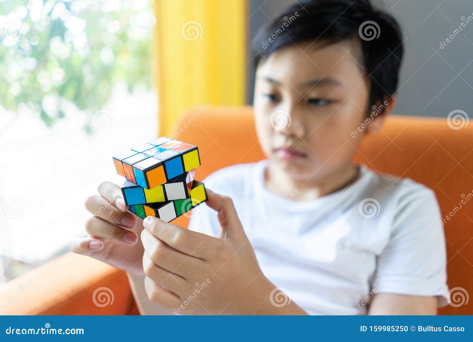Bangkok, Thailand - October 1, 2019: Little Boy Play Rubik`s Cube ... Bangkok, Thailand - October 1, 2019: Little Boy Play Rubik`s Cube ...
