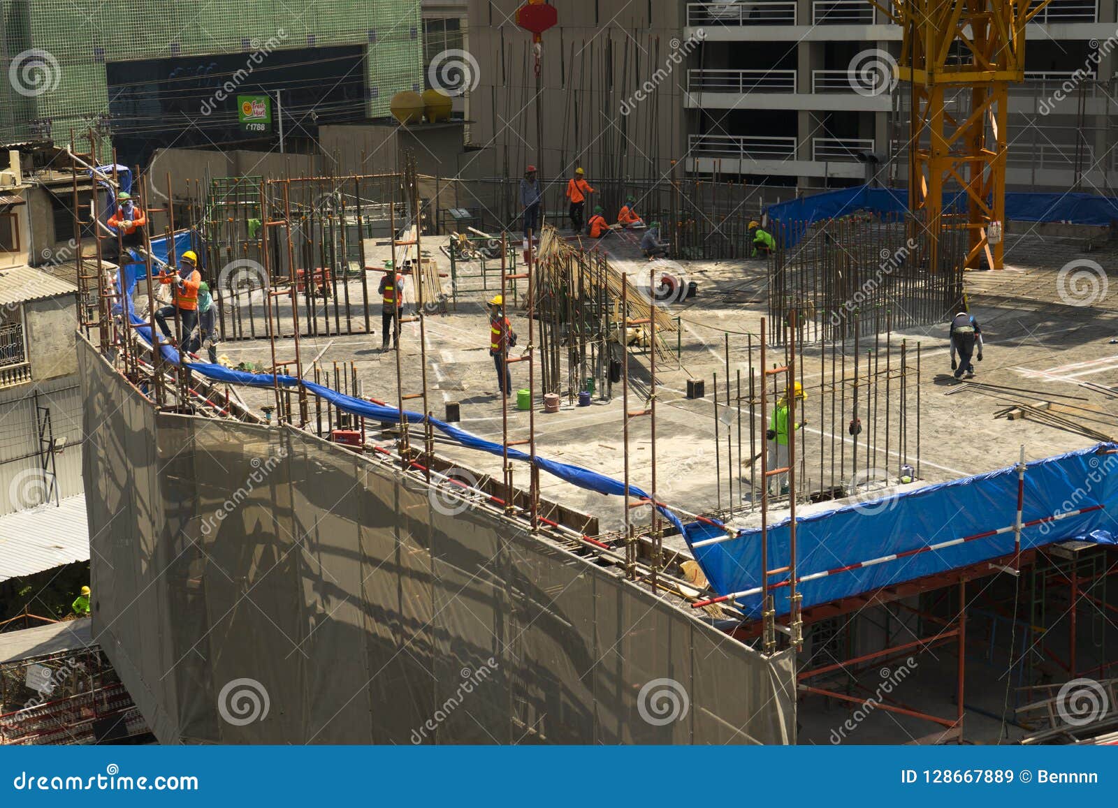 Unidentified Construction Workers Working at High Level of Construction ...
