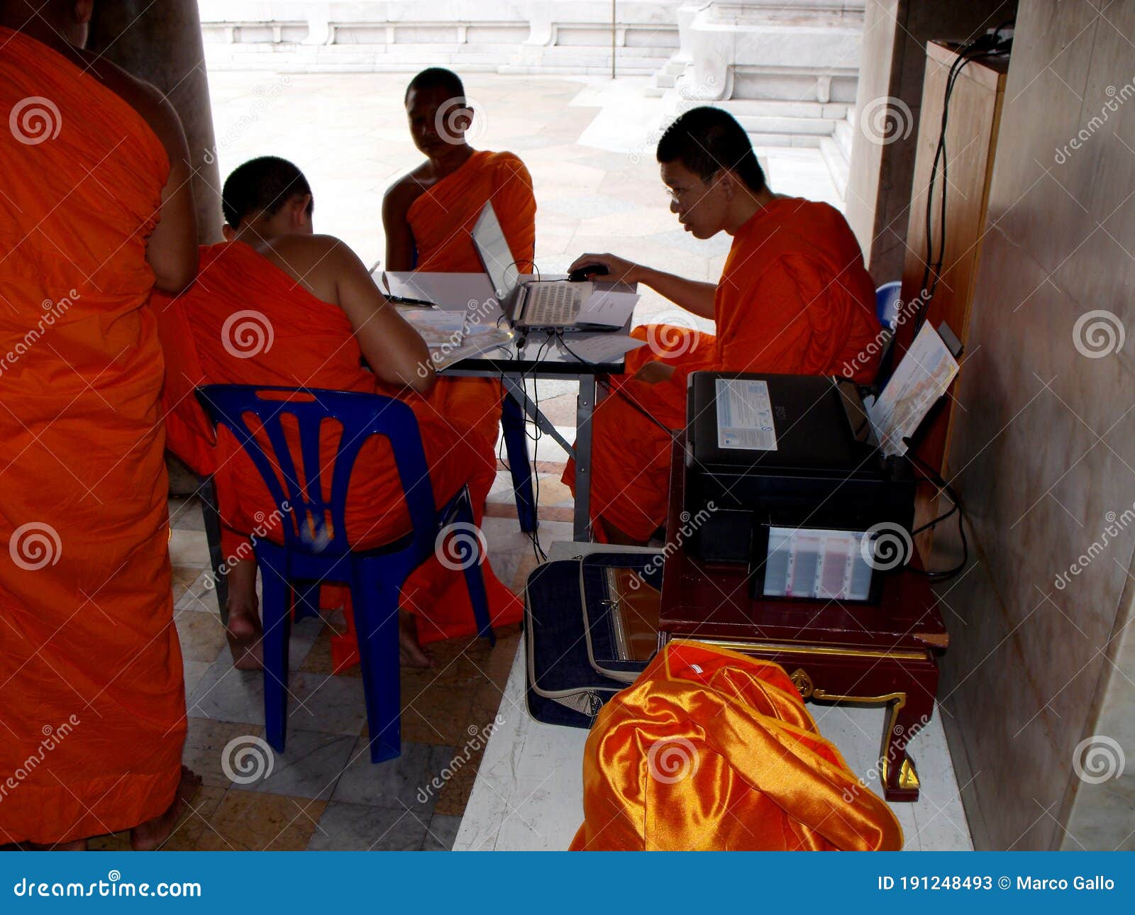 Young Buddhist Monks Study Using a Computer at a Temple in Bangkok ...