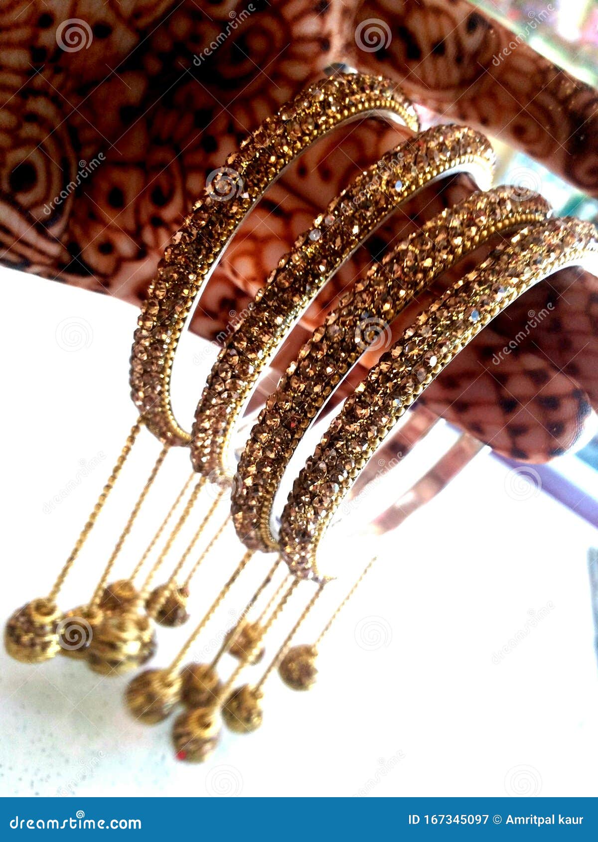 Bangles of golden colour stock image. Image of four - 167345097