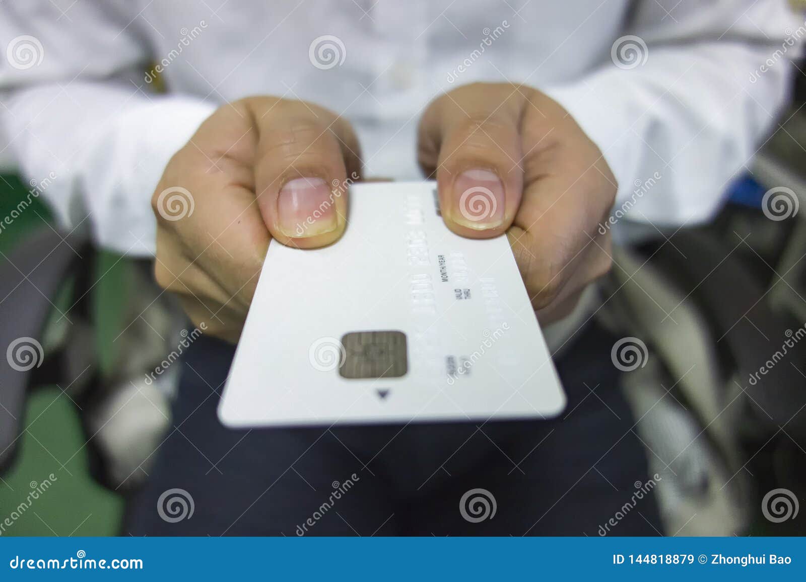 With a bank card in hand editorial stock image. Image of hold - 144818879
