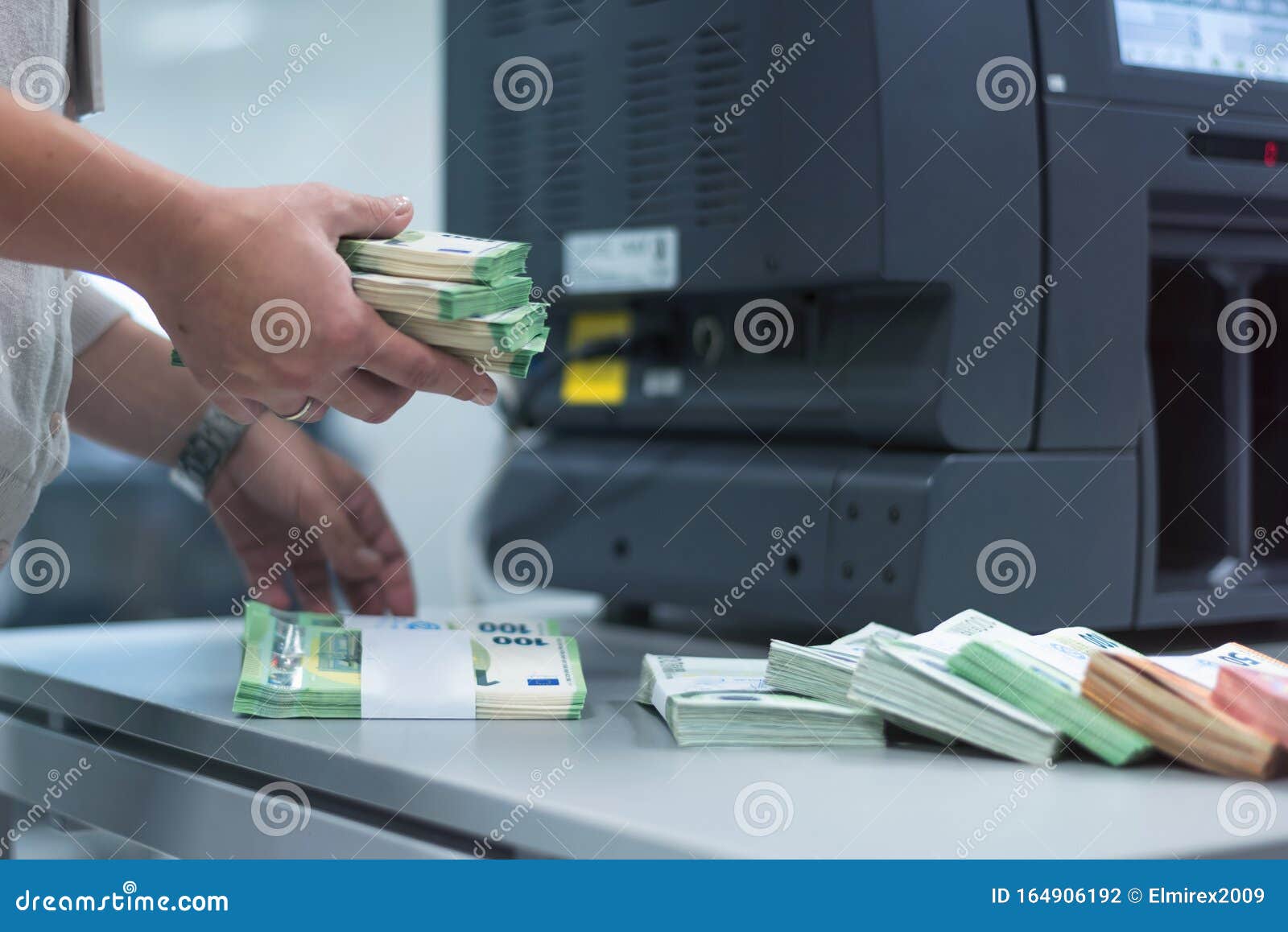 Bank Employees Using Money Counting Machine While Sorting And Counting ...