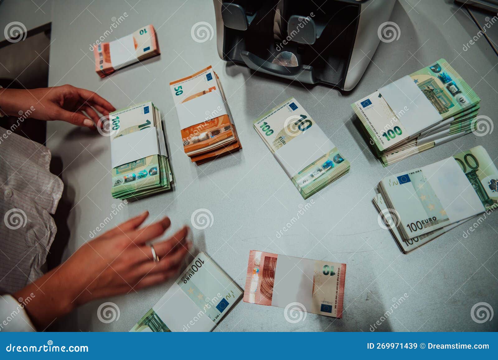 Bank Employees Using Money Counting Machine while Sorting and Counting ...