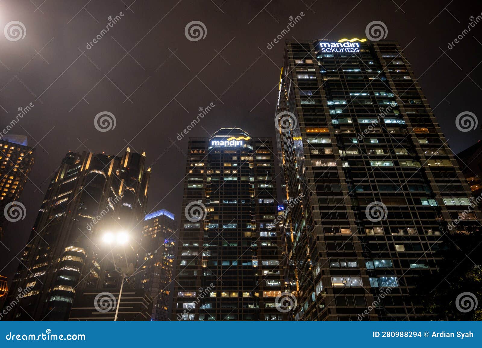 Bank Mandiri and Jakarta City Buildings at Night Around Sudirman Street ... Bank Mandiri and Jakarta City Buildings at Night Around Sudirman Street ...