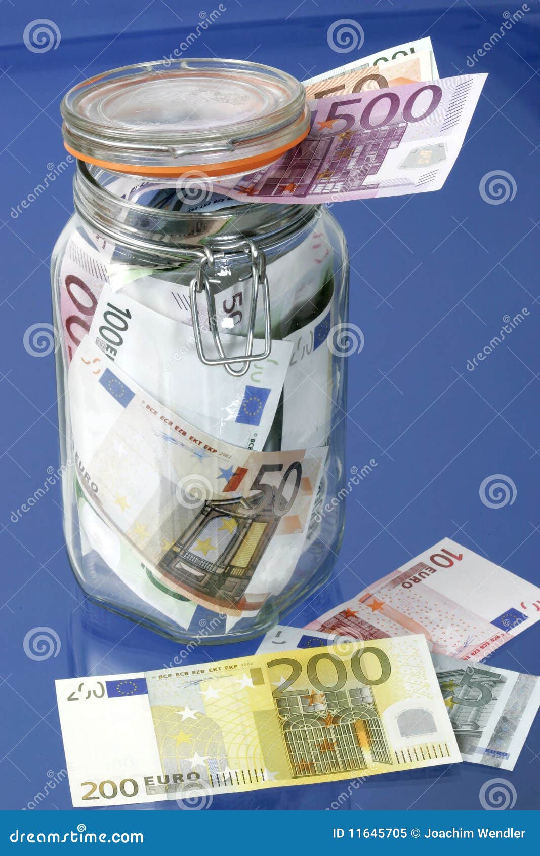 Bank notes in a glass jar stock image. Image of bank - 11645705