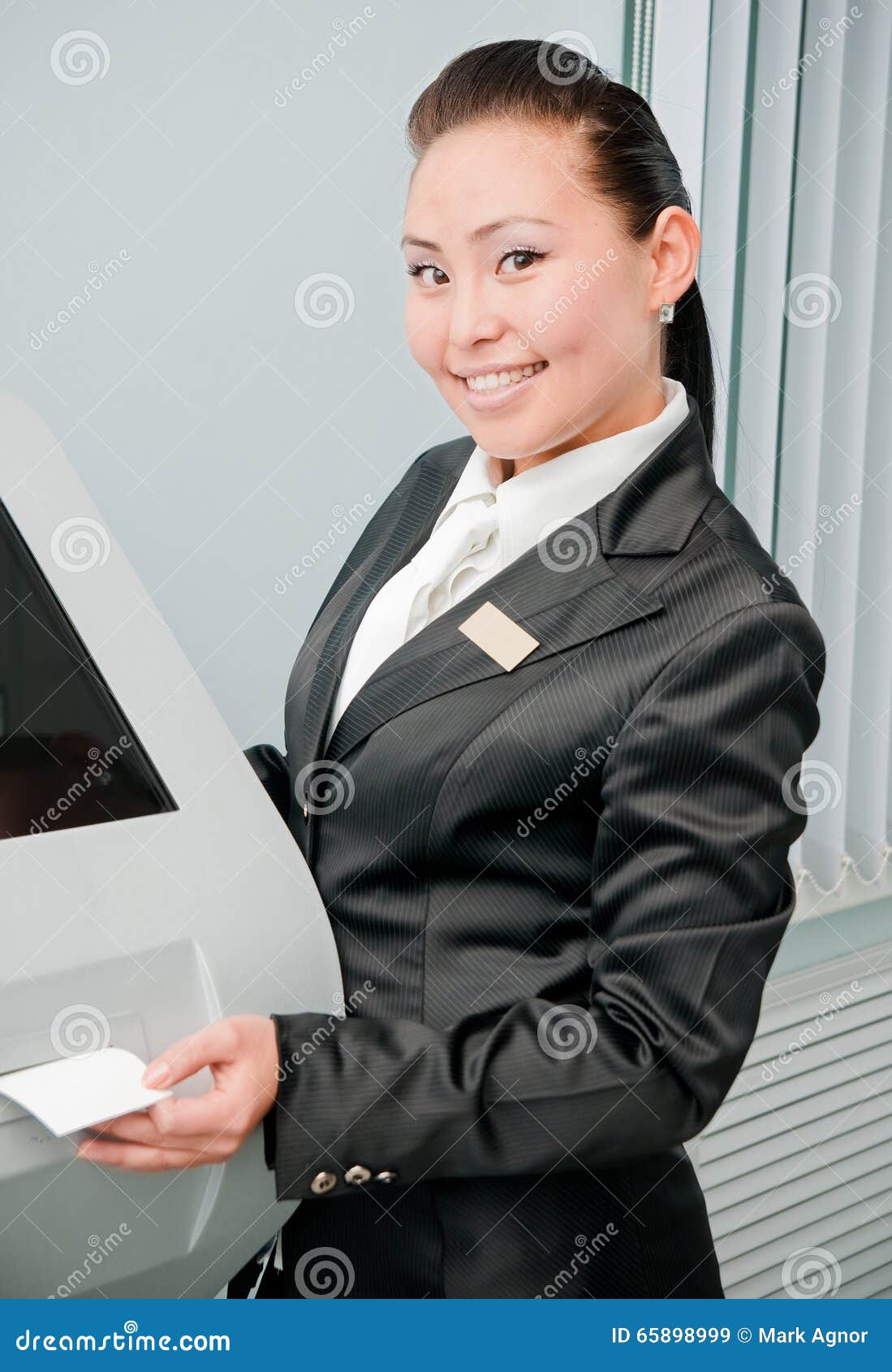 Bank worker by an ATM stock image. Image of lady, machine - 65898999