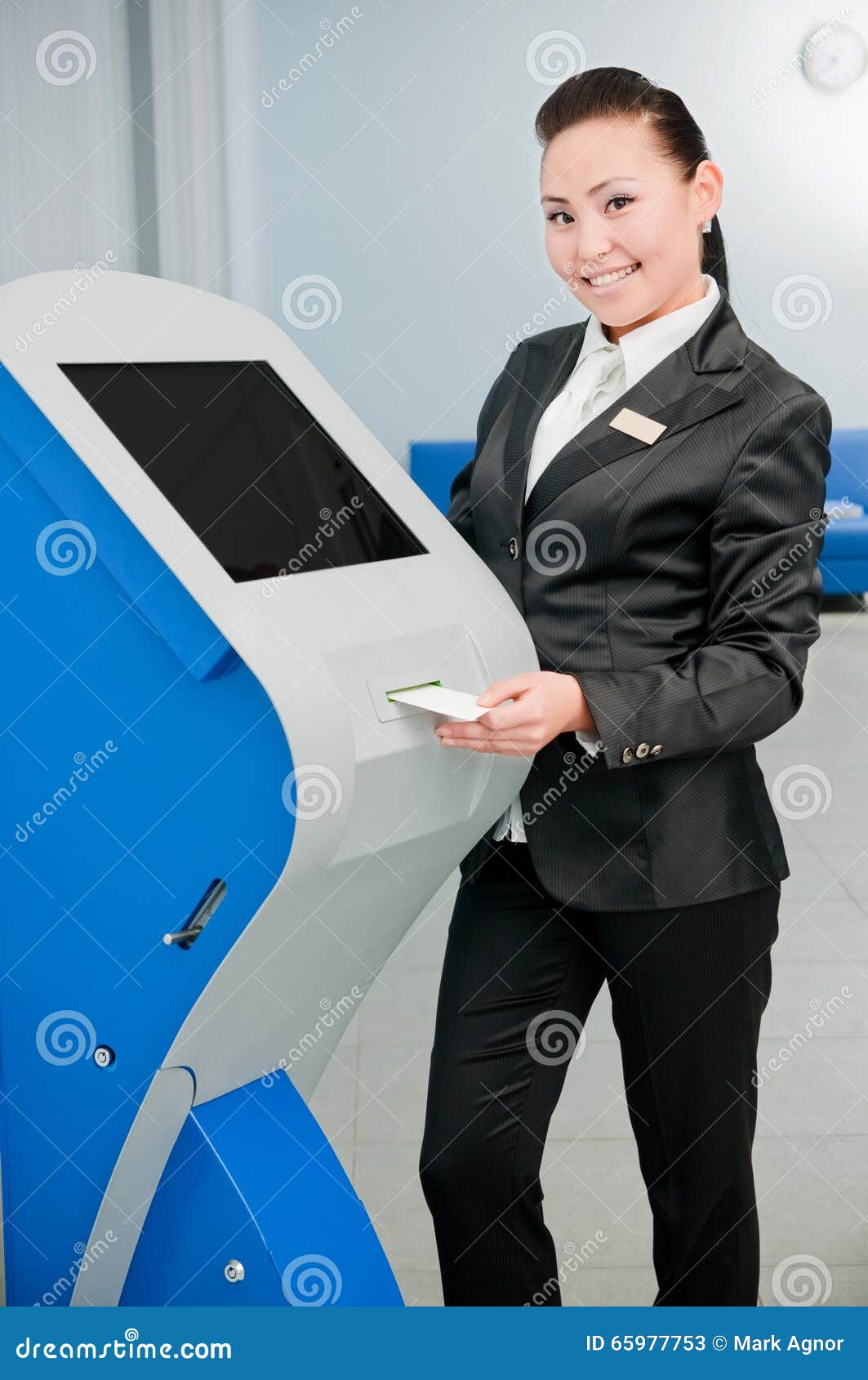 Bank worker by an ATM stock image. Image of happy, lady - 65977753