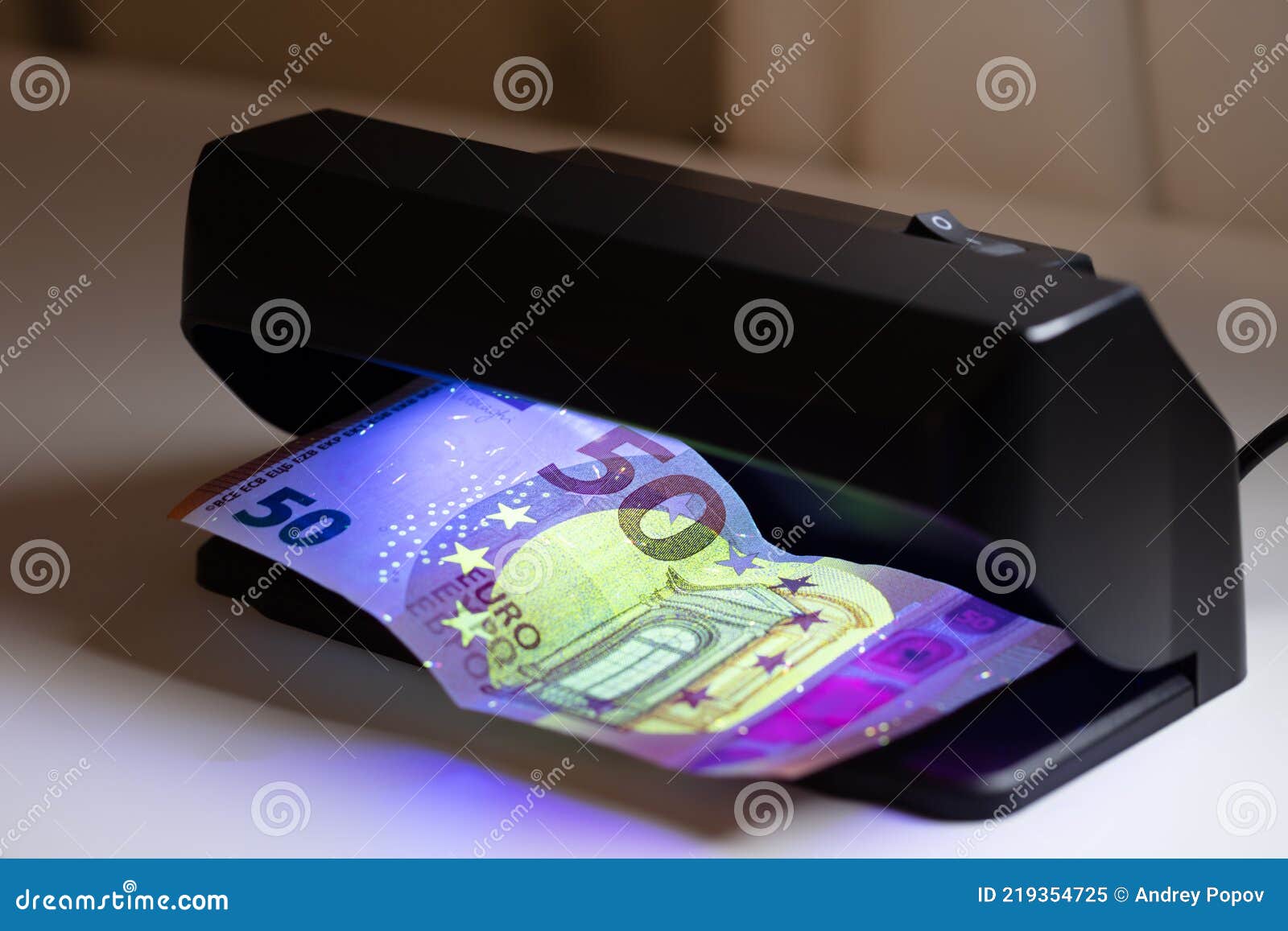 Banknote and Banknote Detector Machine on Desk Stock Image - Image of ...