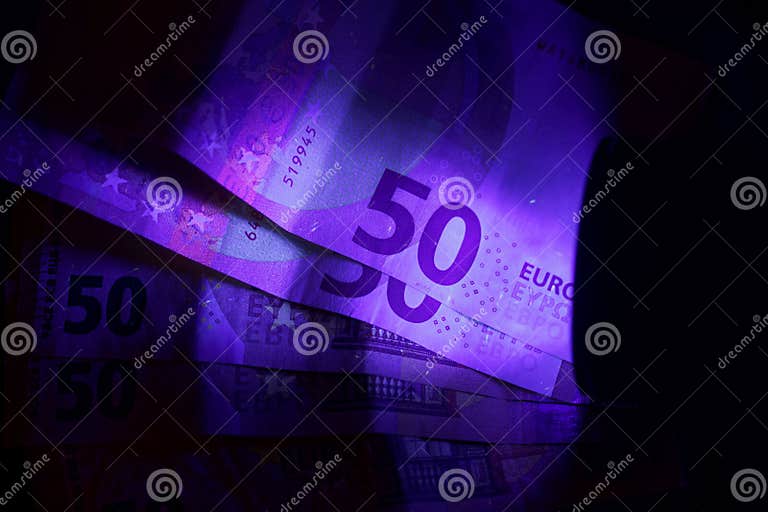 Banknotes in UV light. stock photo. Image of note, change - 109629080
