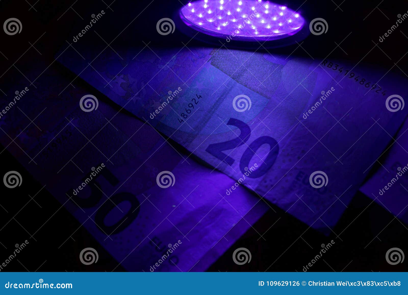 Banknotes in UV light. stock photo. Image of banking - 109629126