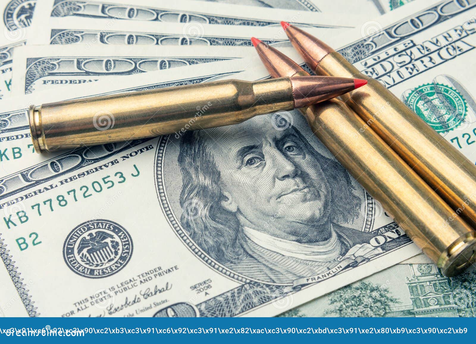 On the Banknotes of Dollars are Fighting Bullets Close-up. Concept of ...