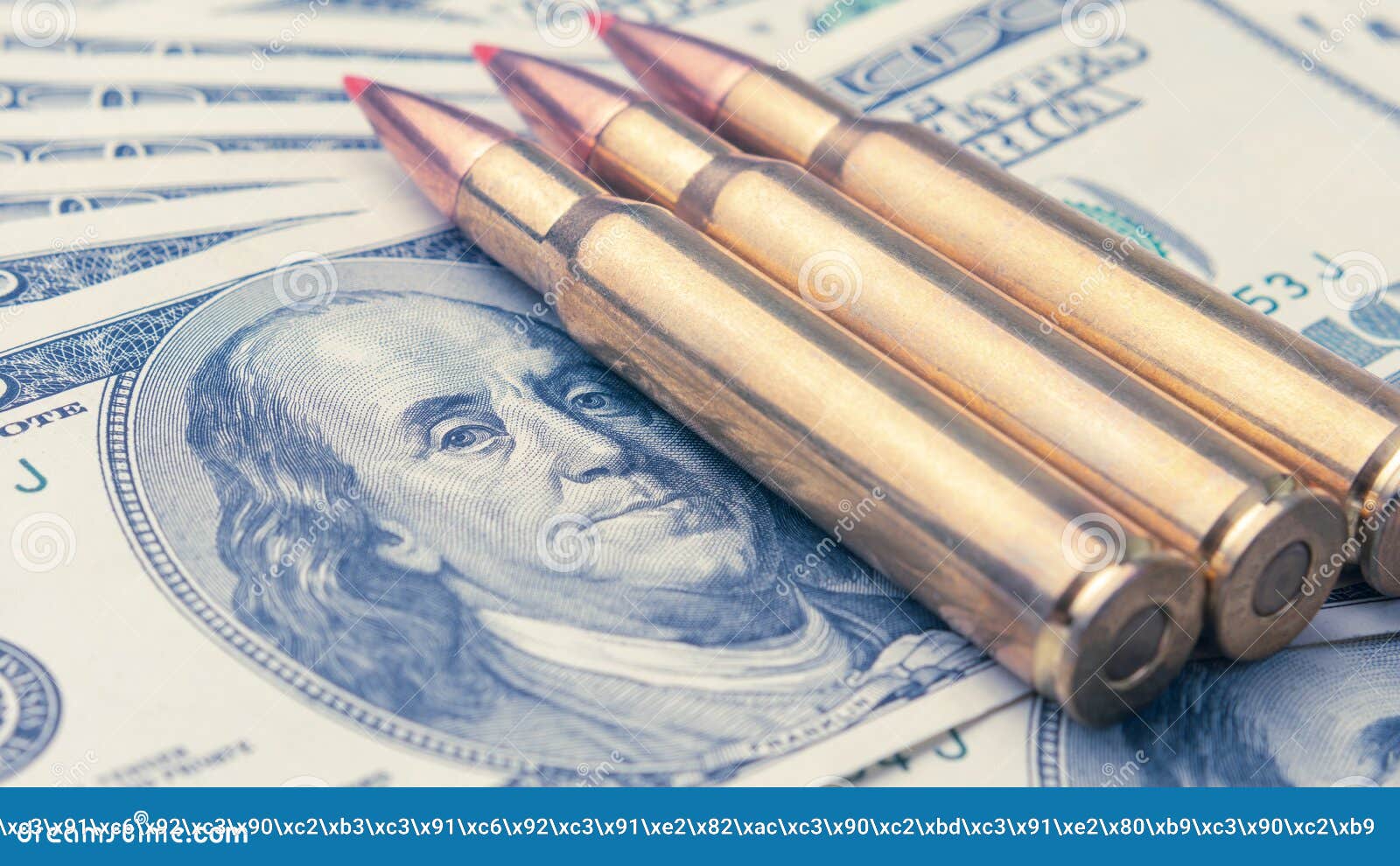 On the Banknotes of Dollars are Fighting Bullets Close-up. Concept of ...