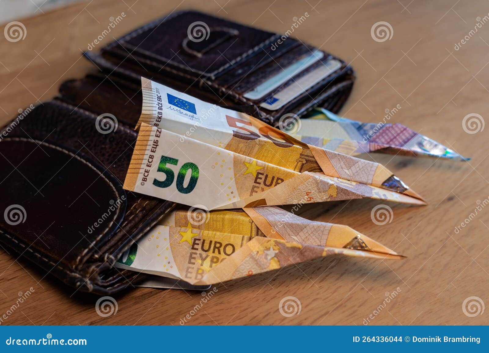 Banknotes Looking Out of a Wallet Stock Photo - Image of financial ...