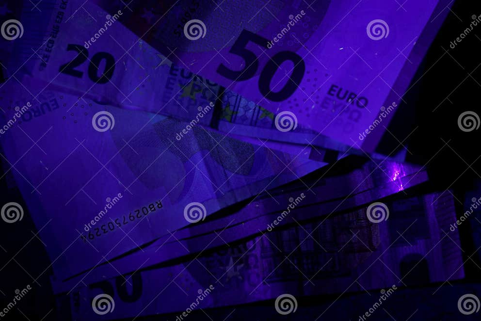 Banknotes in UV light. stock photo. Image of change - 109629102