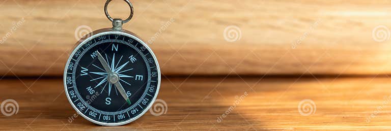 Banner of Compass on Wooden Background with Copy Space Using As ...