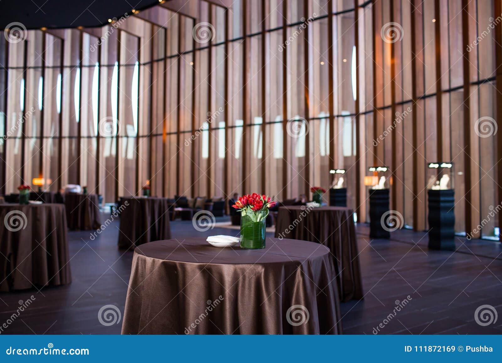 Banquet Hall with High Ceilings and Covered Tables Stock Image - Image ...