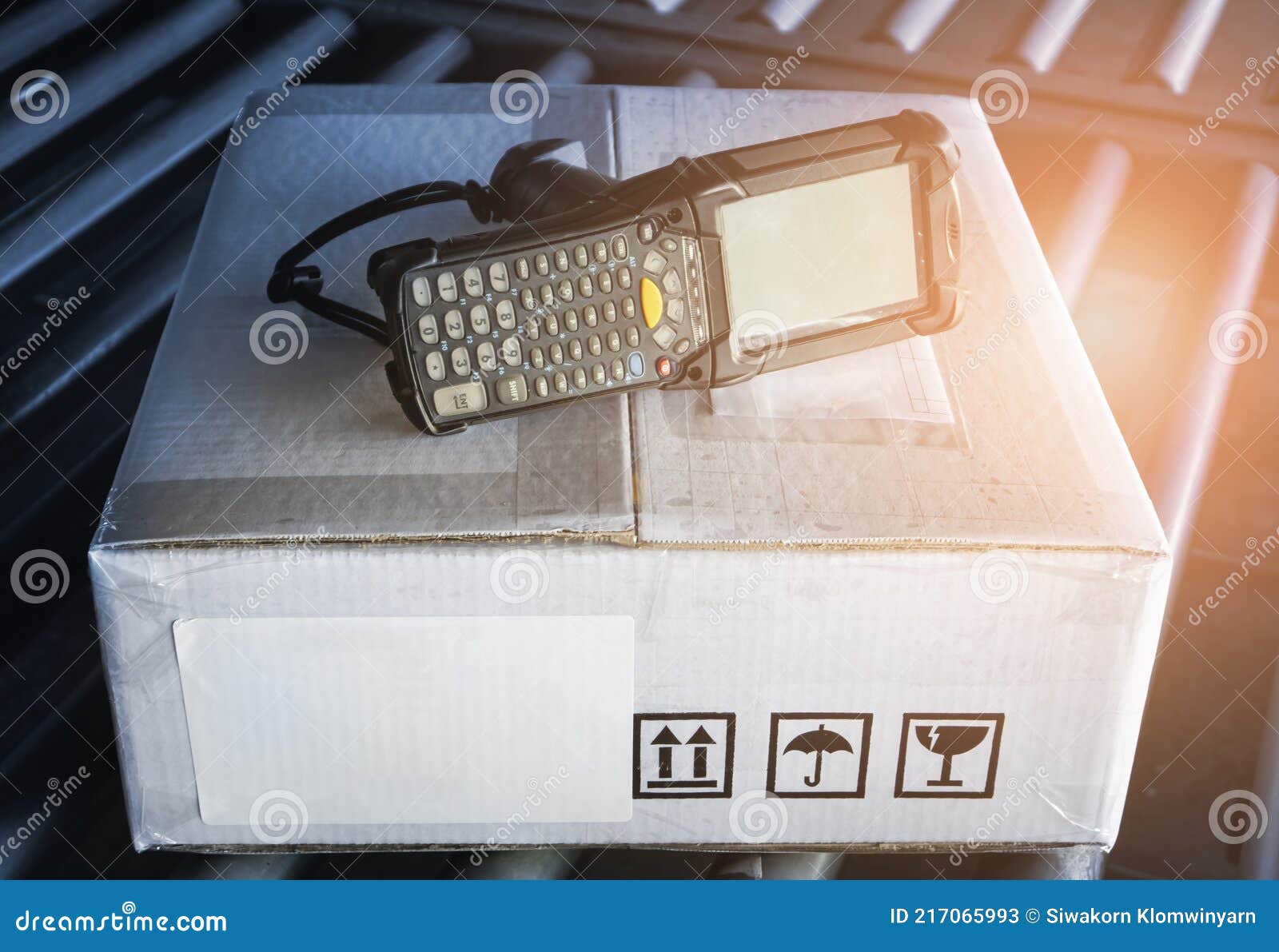 Bar Code Scanner with Package Box on Rollers Conveyor Belt. Computer ...