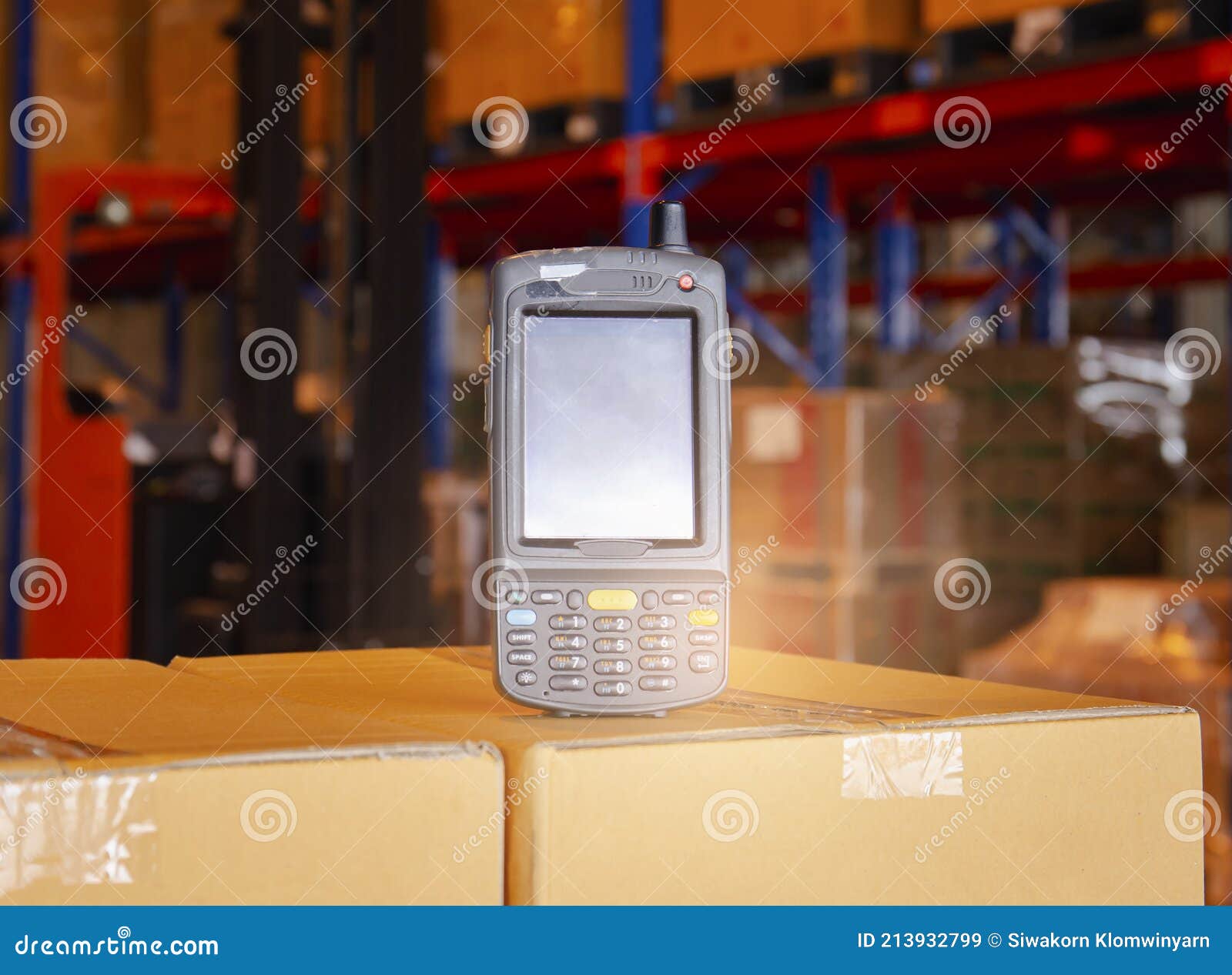 Bar Code Scanner on Package Box at Storage Warehouse. Computer Tools ...