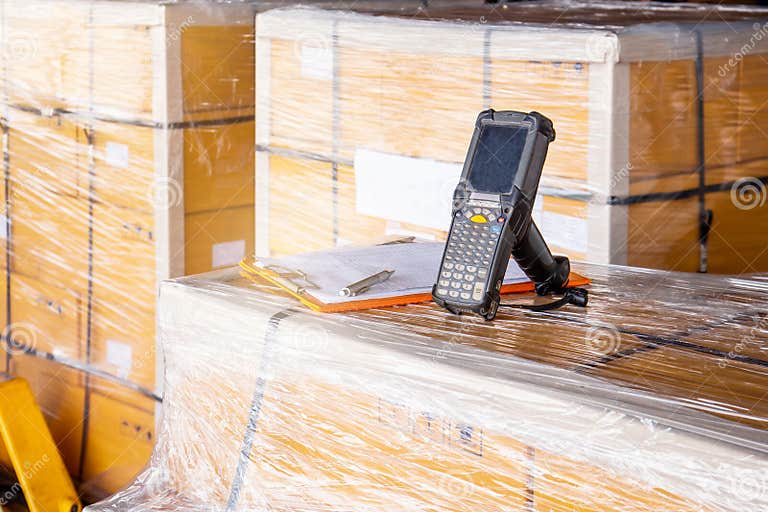 Bar Code Scanner on Package Boxes. Warehouse Space. Shipping Storehouse ...
