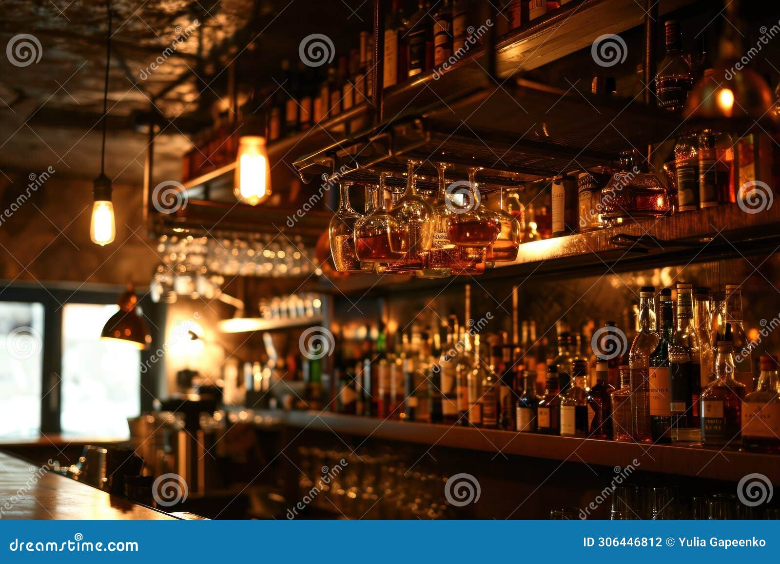 Bar Counter with Liquor Bottles Hanging from the Ceiling Stock Photo ...