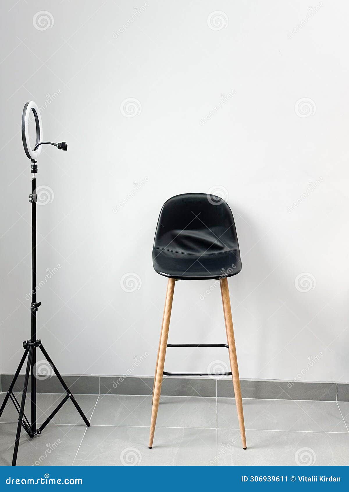 Bar Stool and a Ring Lamp Against a White Wall Stock Image - Image of ...