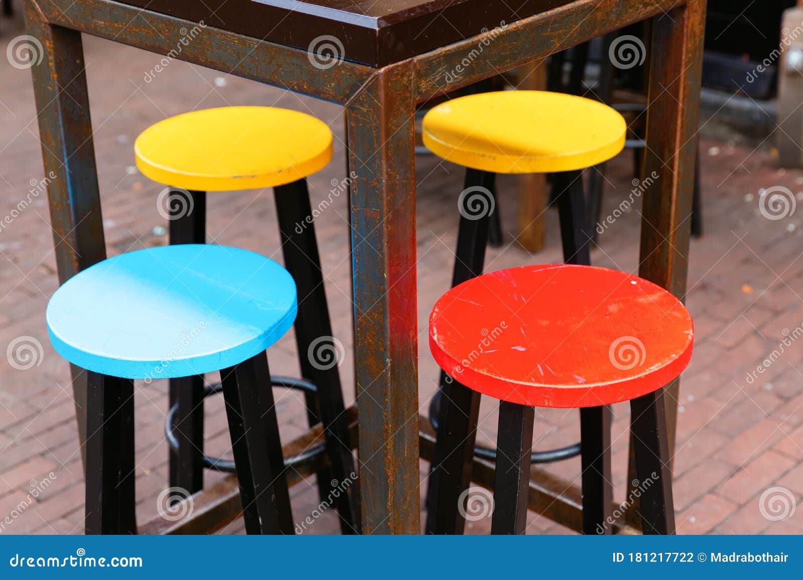 Bar Stools with Different Colors at an Outdoor Cafe Stock Photo - Image ...