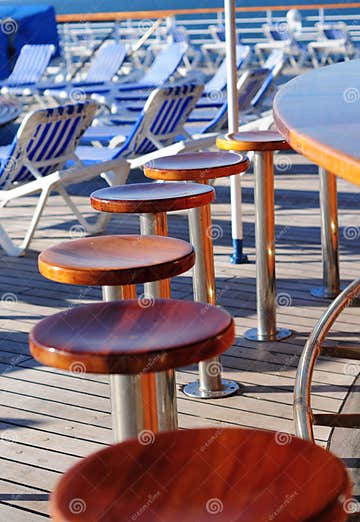 Bar stools on ship deck stock image. Image of pattern - 8185979