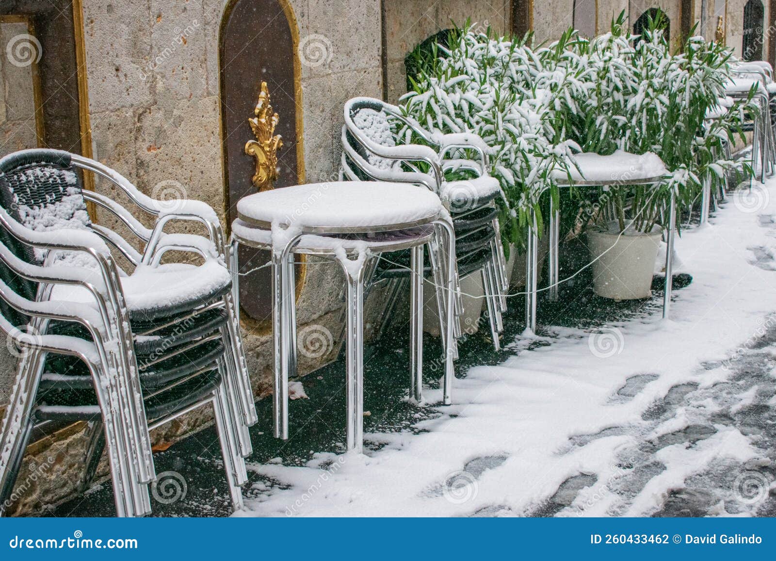 Bar Tables and Chairs on the Street with Snow and Ice Stock Photo ...