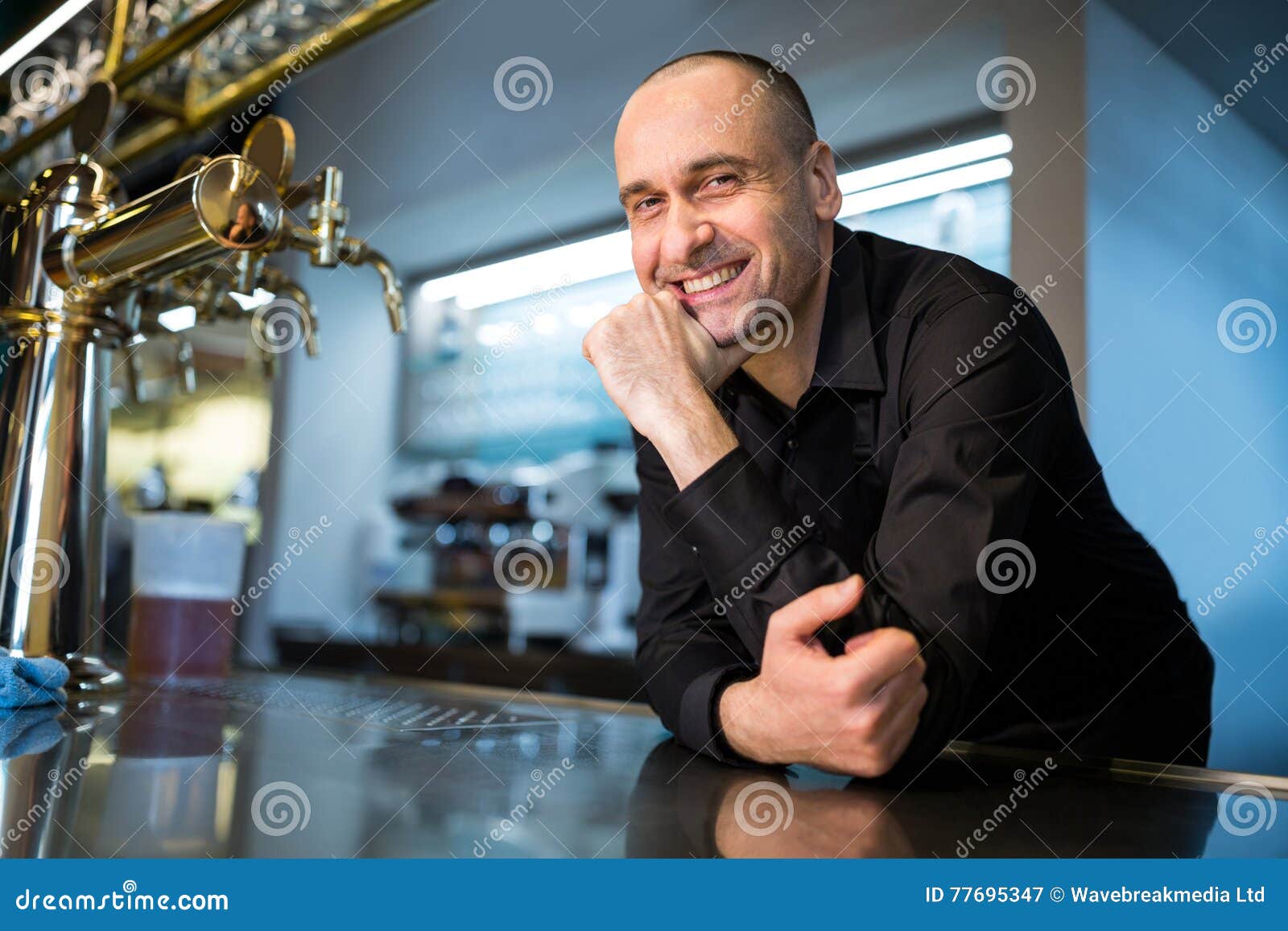 Bar Tender Leaning at Bar Counter Stock Image - Image of people ...