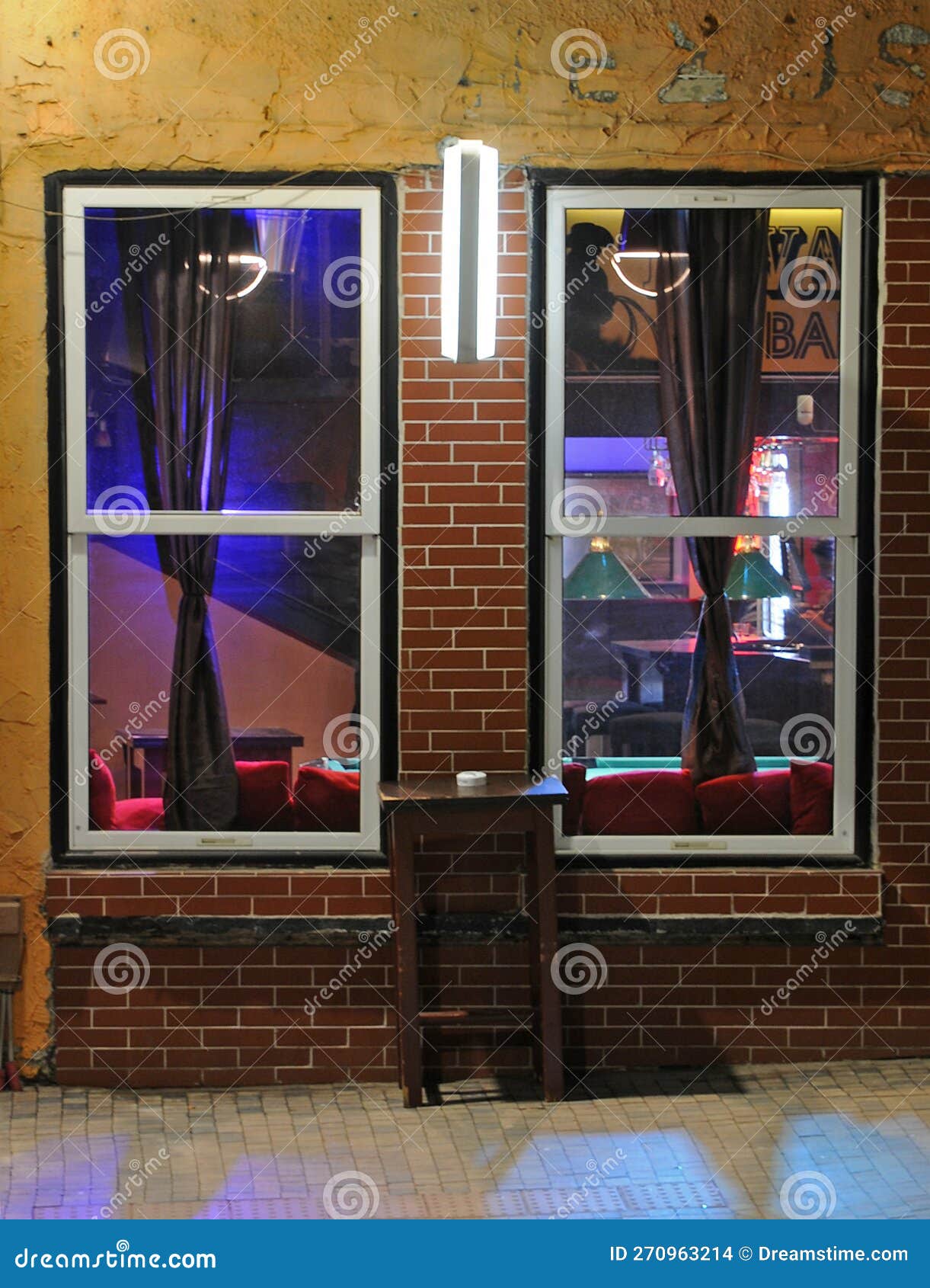 Bar windows at night stock photo. Image of town, exterior - 270963214