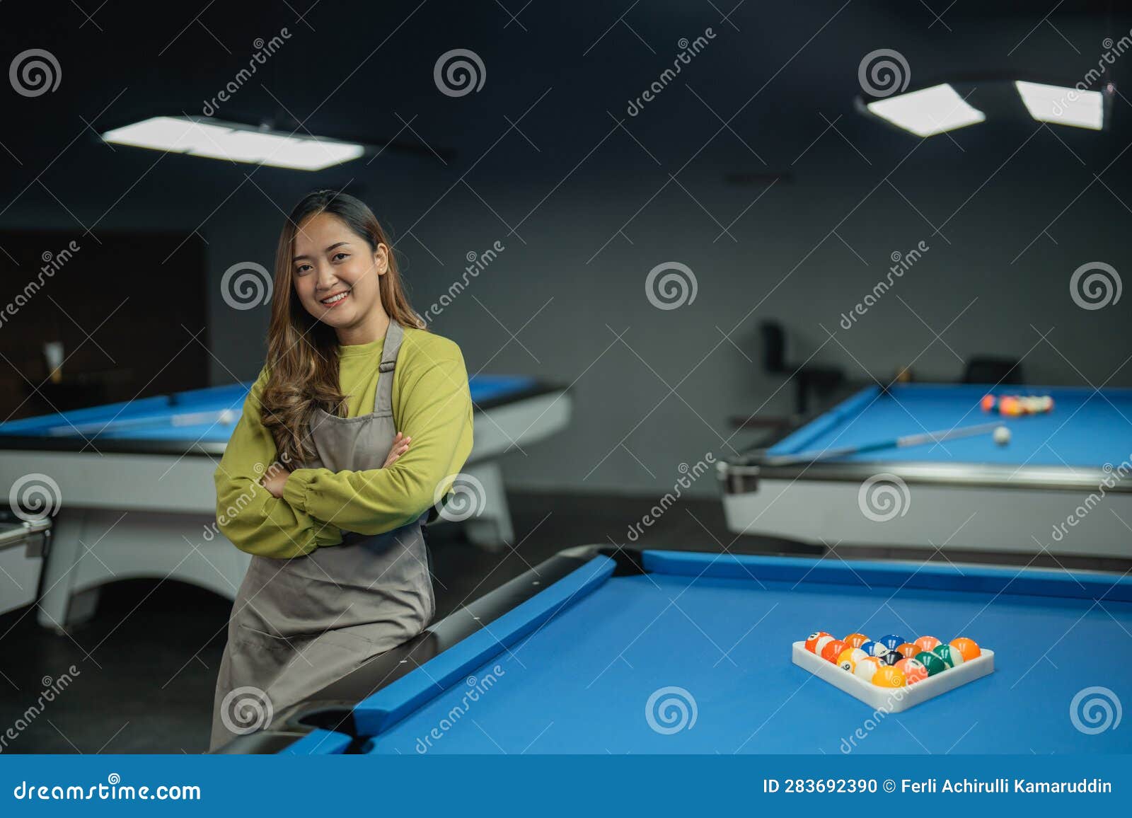 Bar Worker Smiling while Standing on the Pool at the Biliard Studio ...