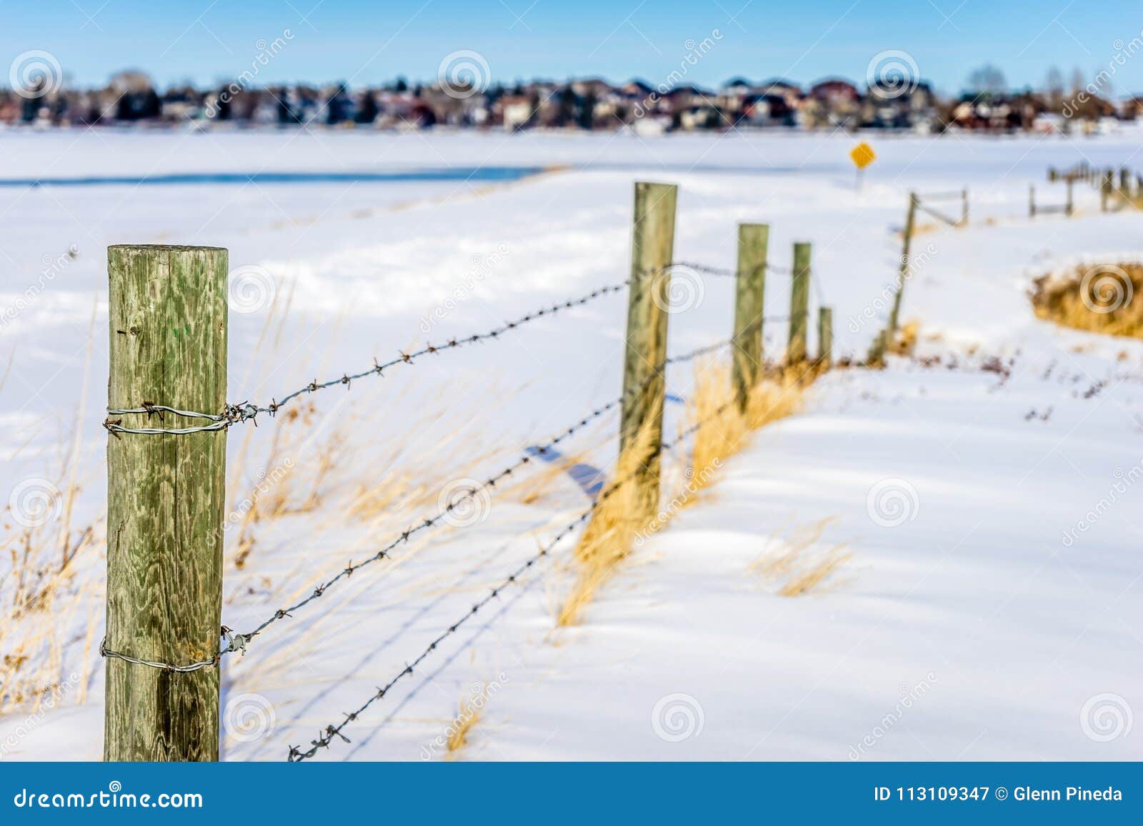 A Barb Wire Fence in a Snow Covered Field Stock Image - Image of field ...