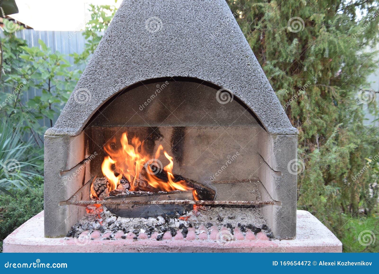 Barbecue with burning logs stock photo. Image of barbecue - 169654472