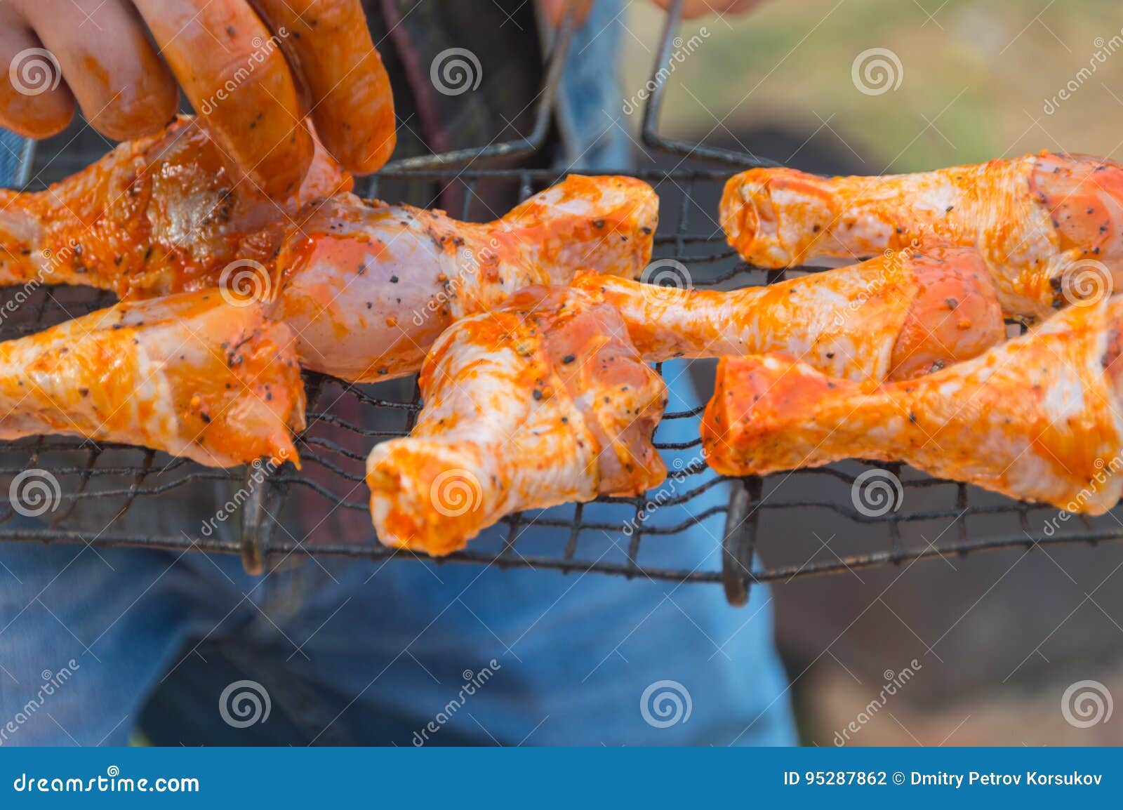 For a Barbecue Grill, Spread the Chicken Man`s Hands. Stock Photo ...