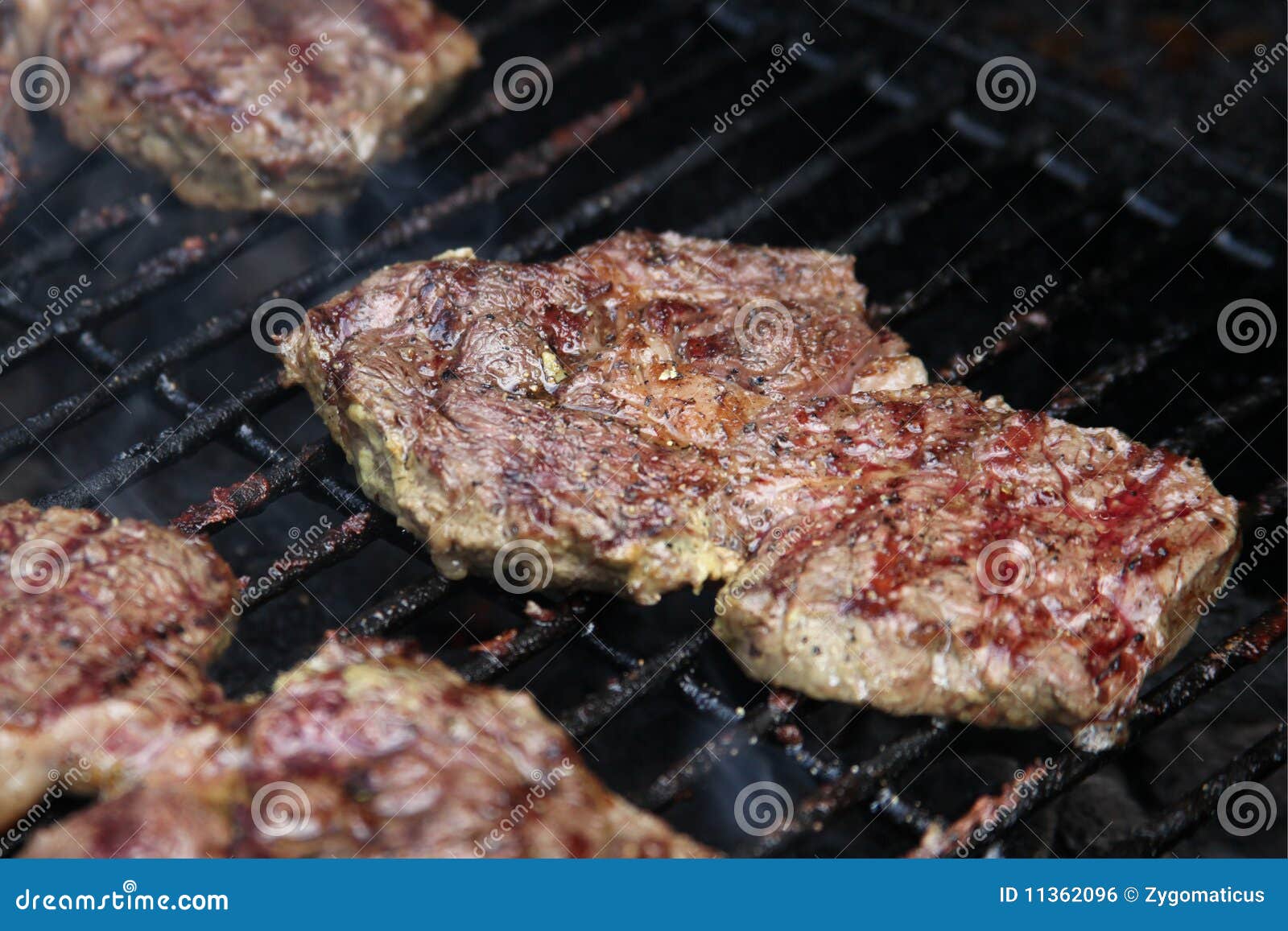 Barbecue Meat on Grill with Smoke Close-up Stock Photo - Image of ...