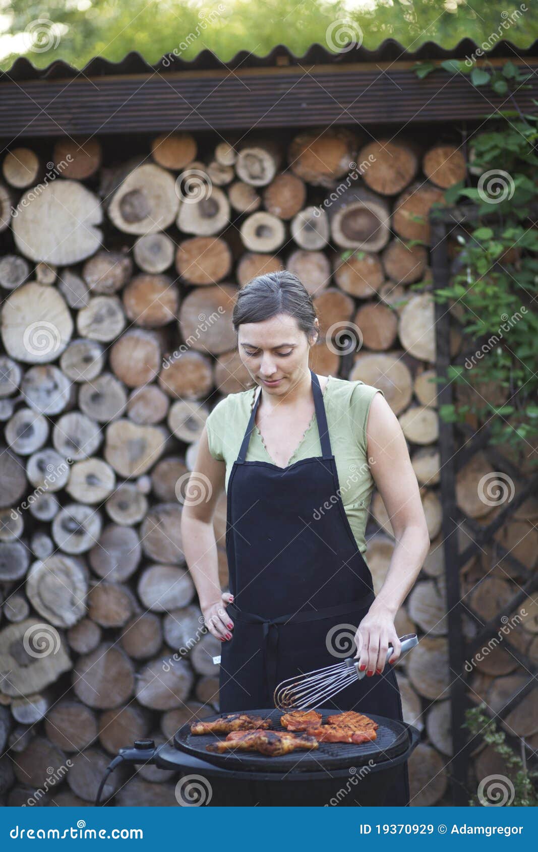 Barbecue Woman in the Garden Stock Image - Image of barbecue, black ...