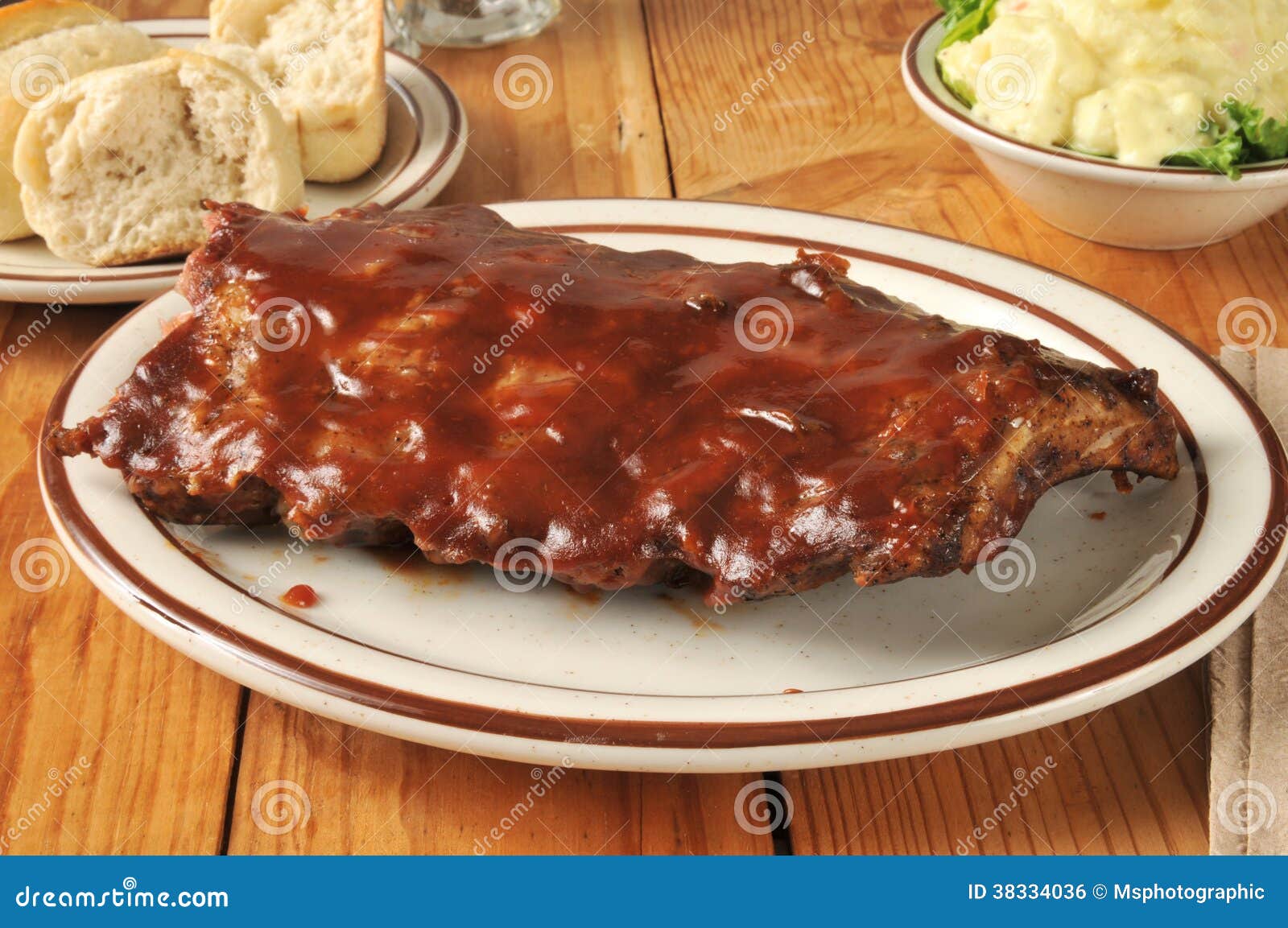 Barbecued Ribs with Potato Salad Stock Photo - Image of horizontal ...