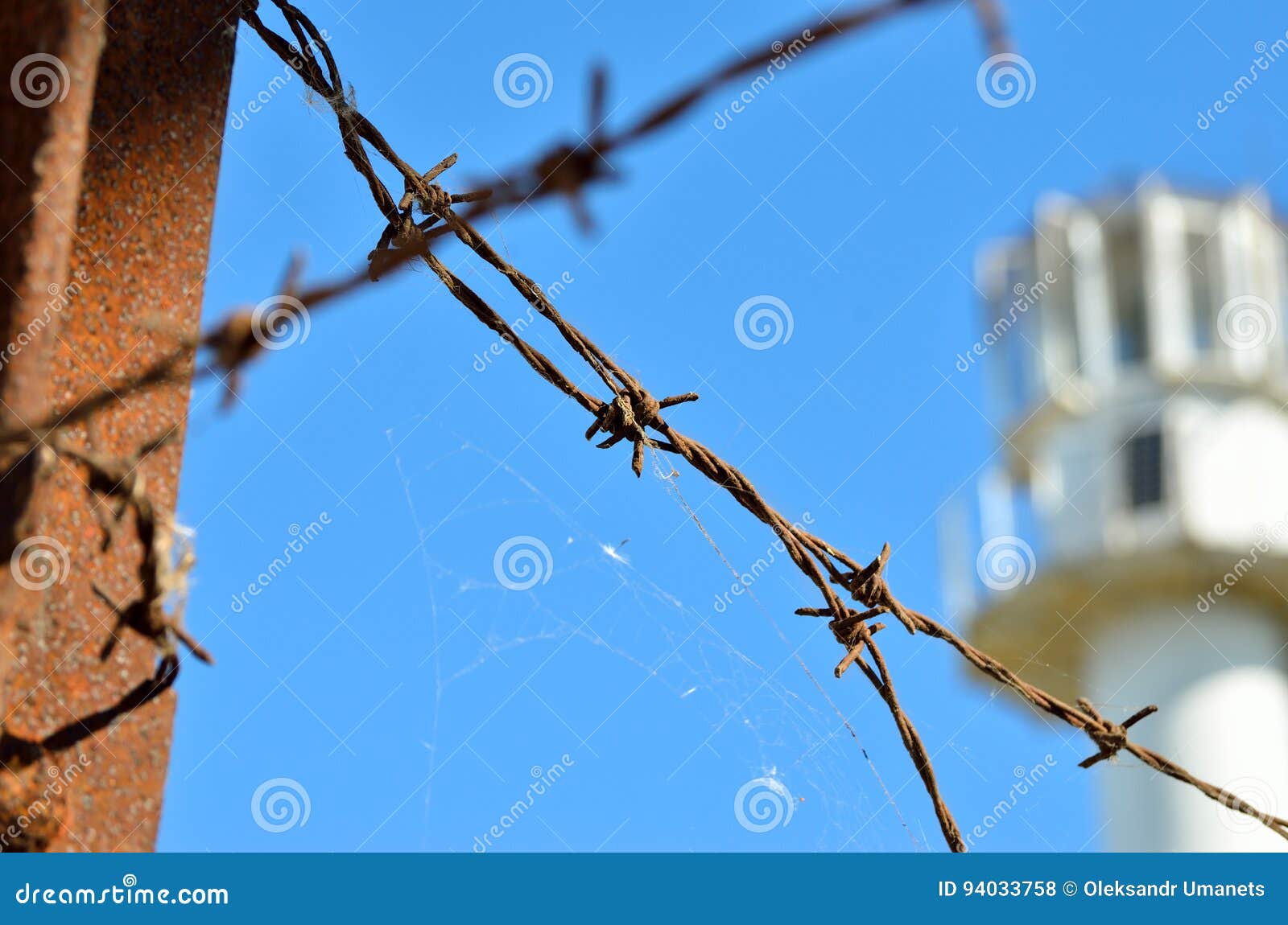 Barbed Wire Against the Backdrop of the Prison Watchtower Stock Photo ...