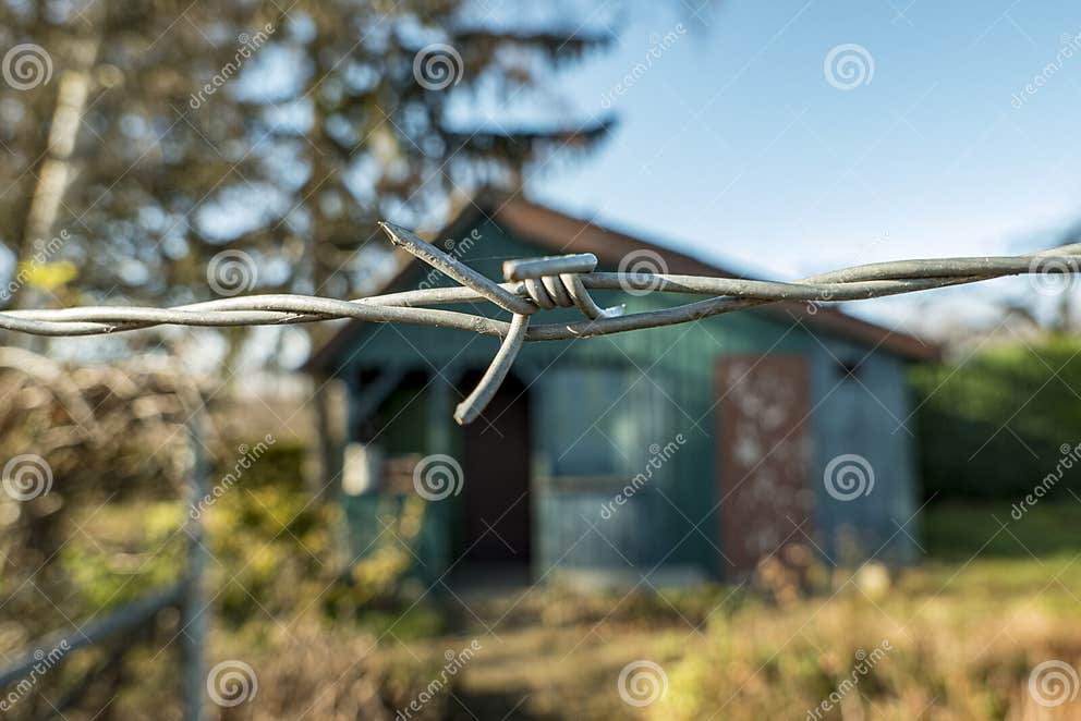 Barbed Wire with Blurred Background of a House Stock Image - Image of ...