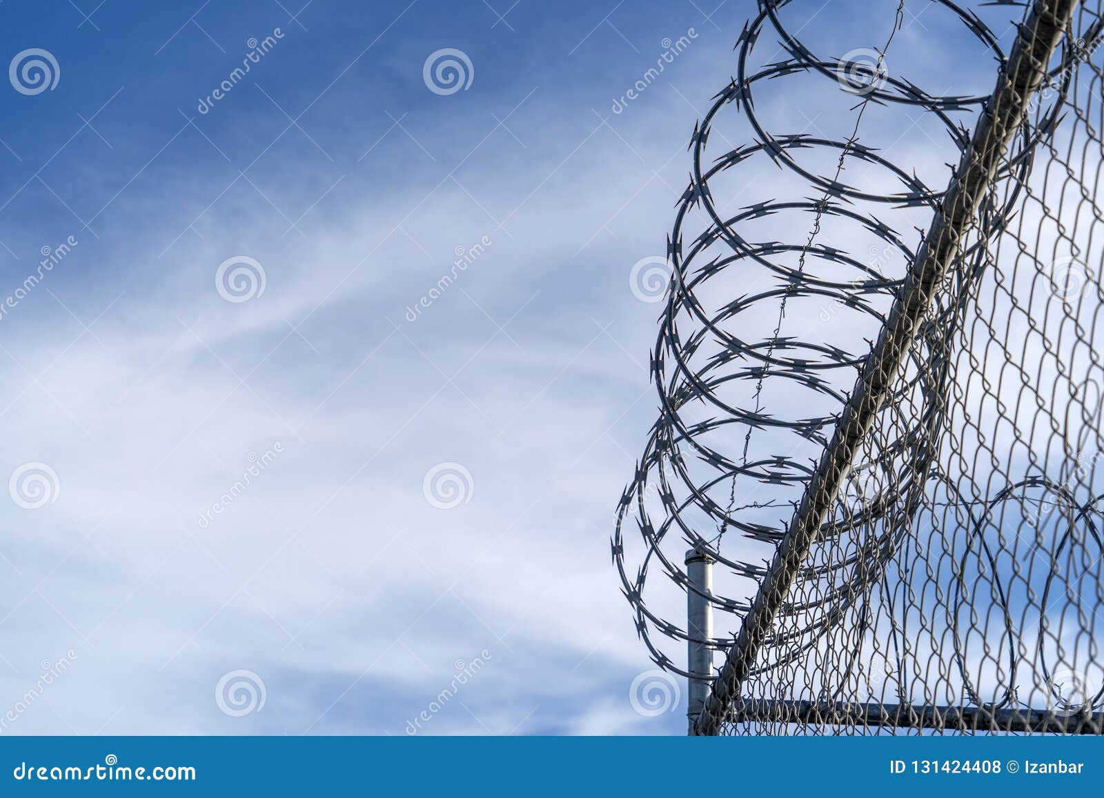 Barbed Wire Fence on Blue Sky Background Stock Photo - Image of barb ...