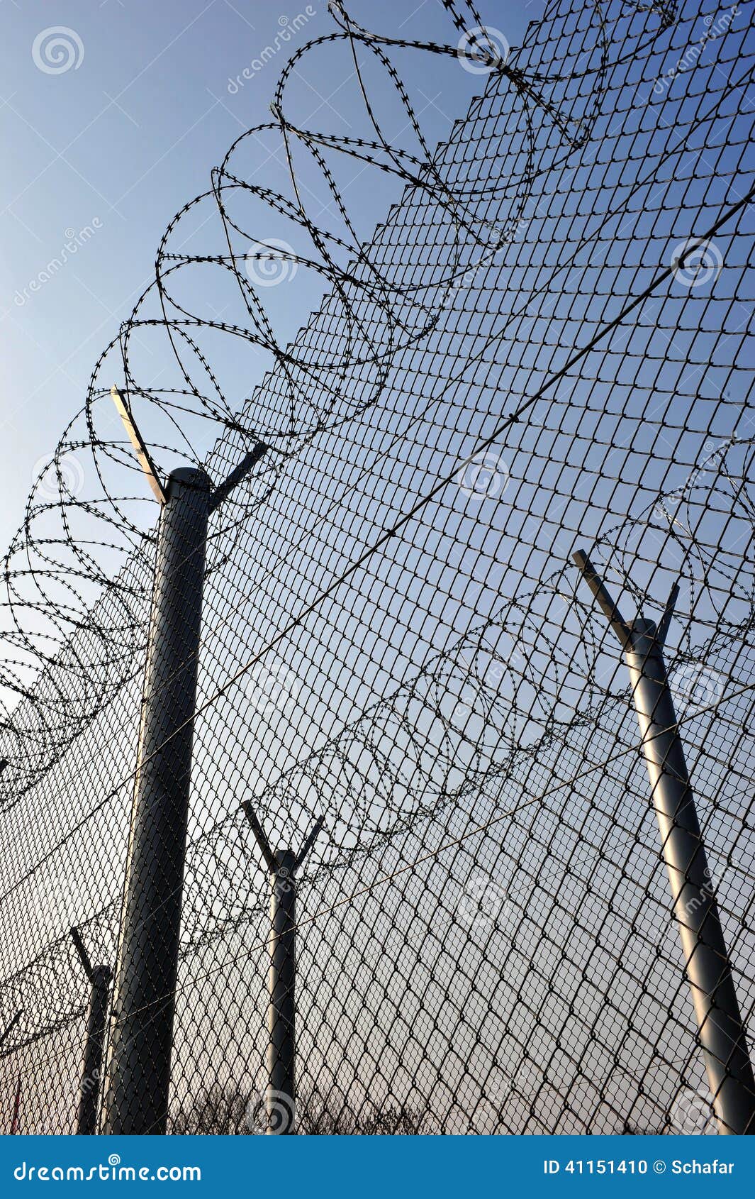 A Barbed Wire Fence with Razor Sharp Wires Stock Photo - Image of ...