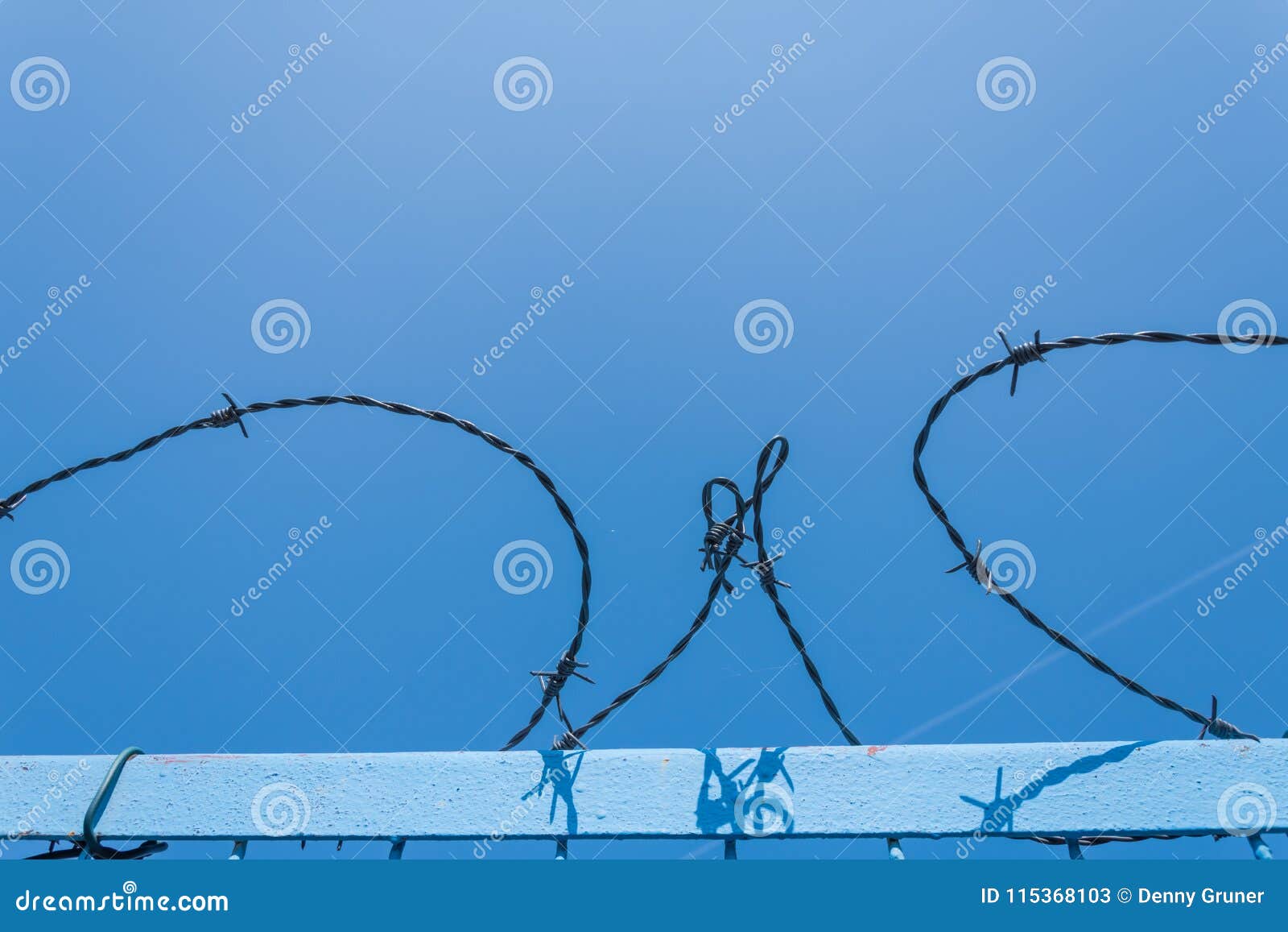 Barbed wire at a gate stock image. Image of blue, entry - 115368103