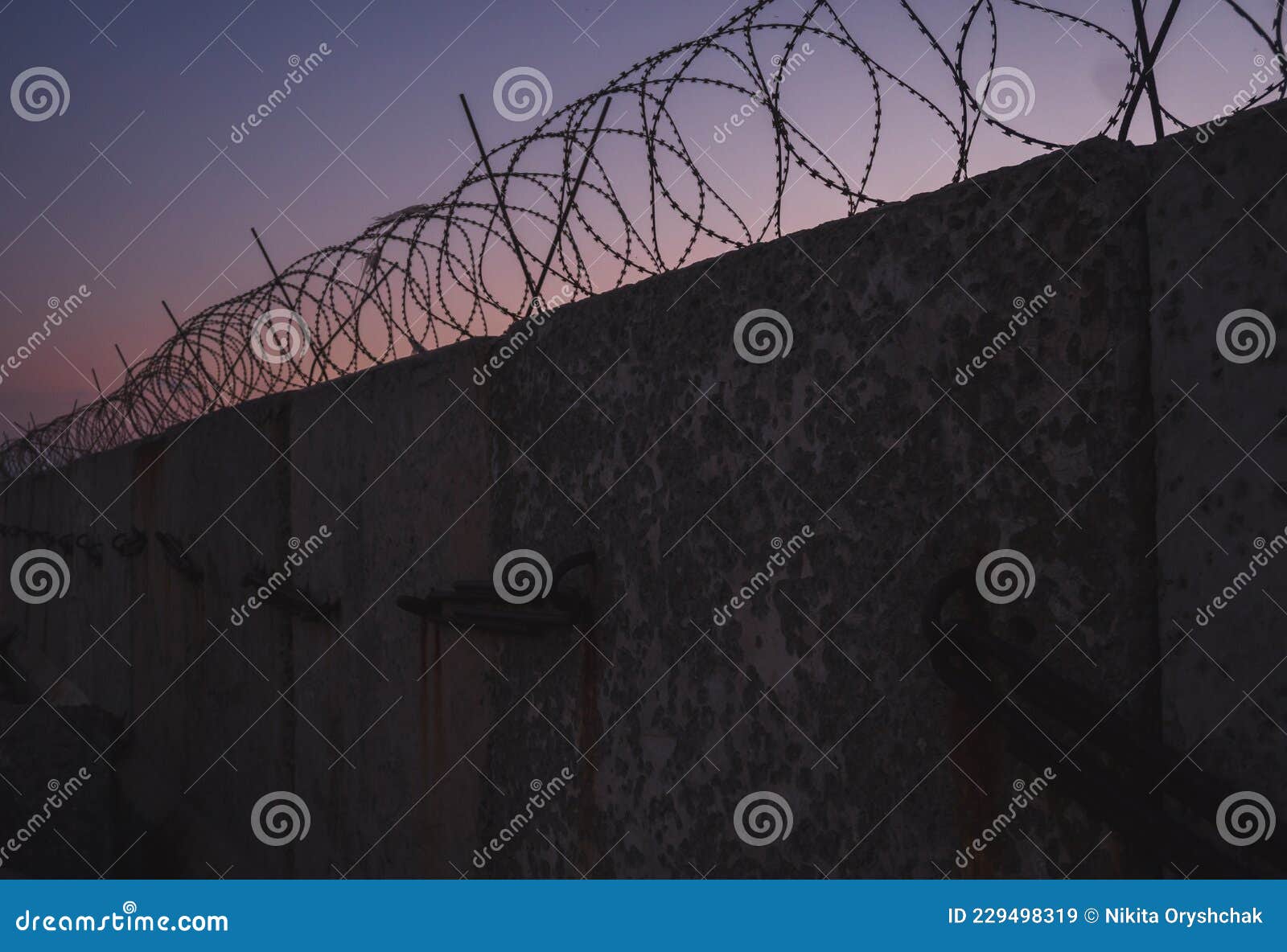 Barbed Wire Prison Wall. Sunset. Panorama. Stock Image - Image of sign ...