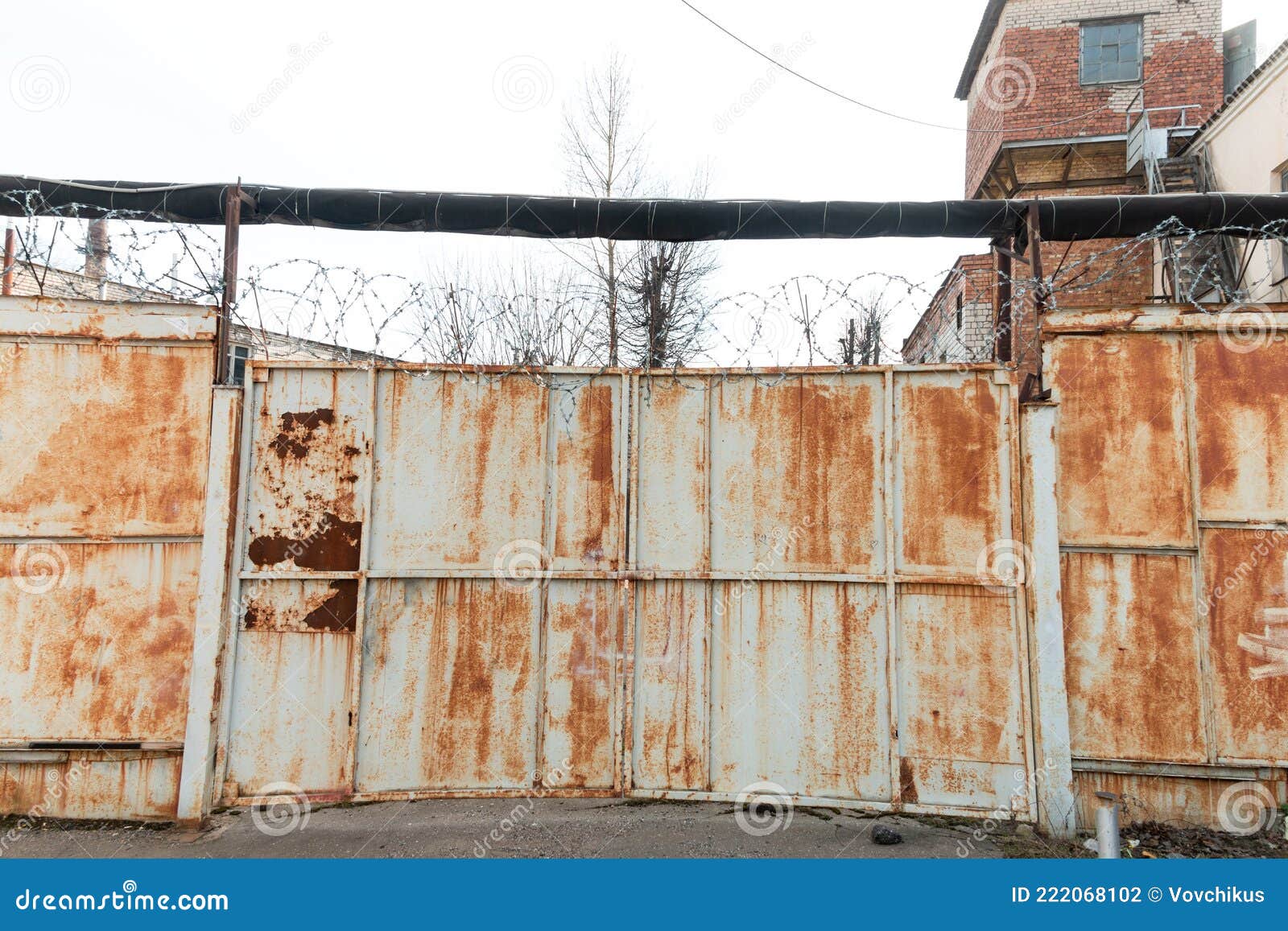 Barbed Wire on Rusty Iron Doors and Walls. Stock Photo - Image of ...