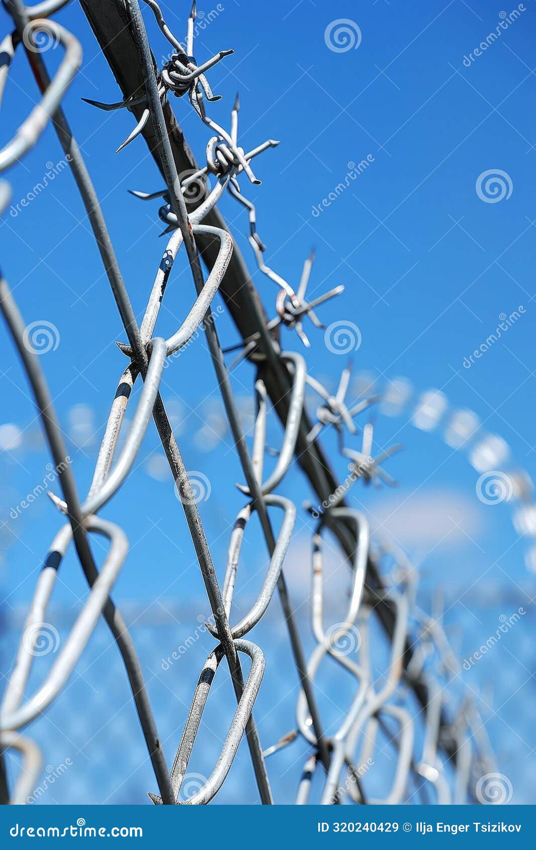 Barbed Wire Securing the Top of a Sturdy Concrete Fence Wall for ...