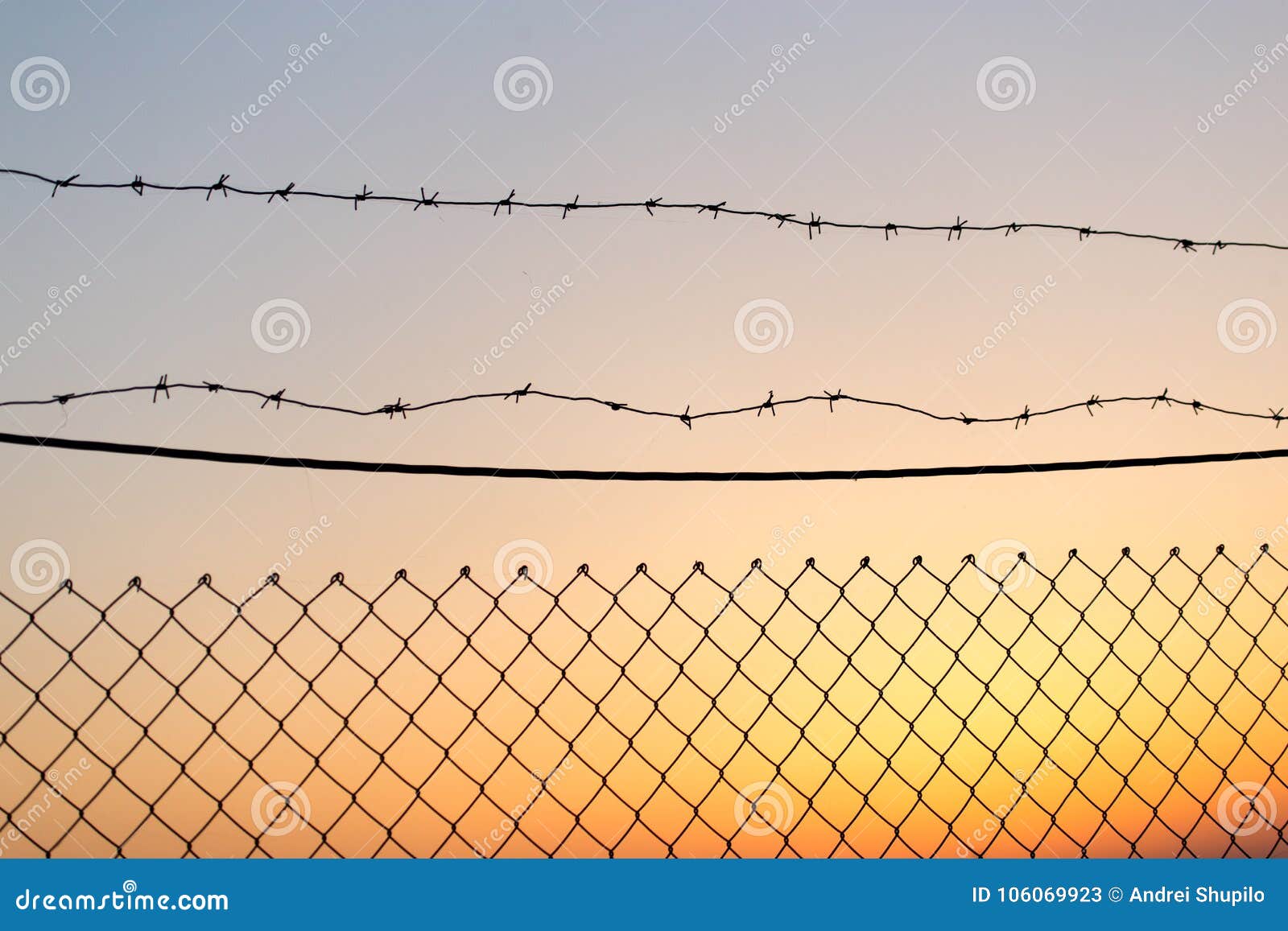Barbed wire at sunset stock image. Image of silhouette - 106069923
