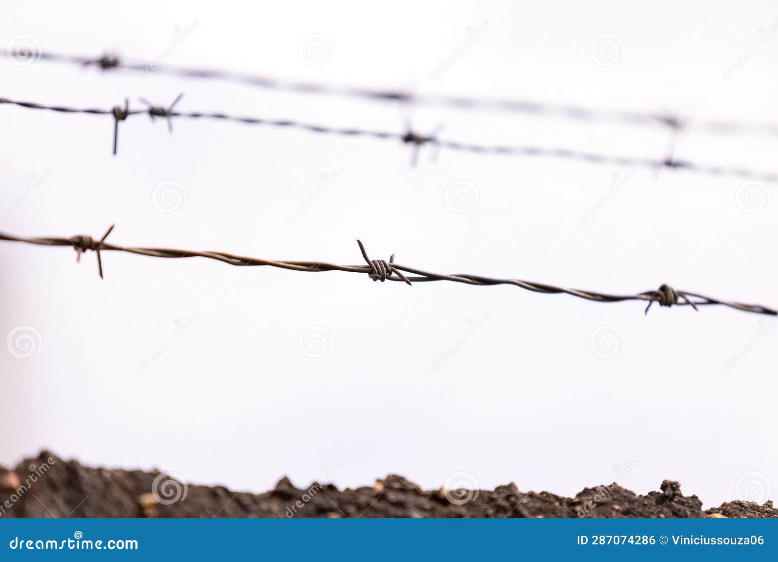 Barbed Wire on Top of a Fence Stock Photo - Image of prison, barbed ...