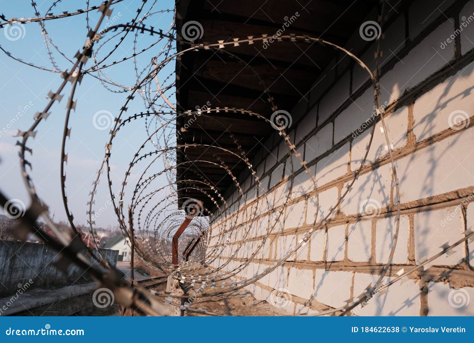 Barbed Wire Under Electricity Above the Fence Stock Photo - Image of ...