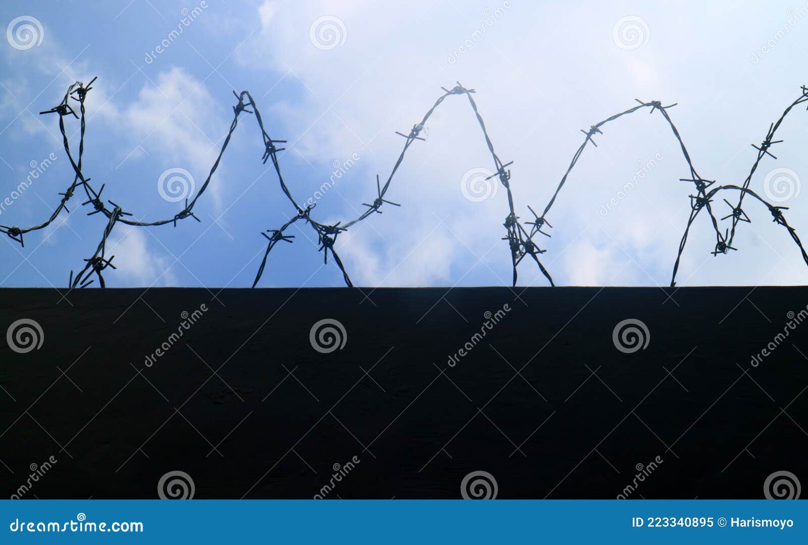 Barbed wire on wall stock image. Image of background - 223340895